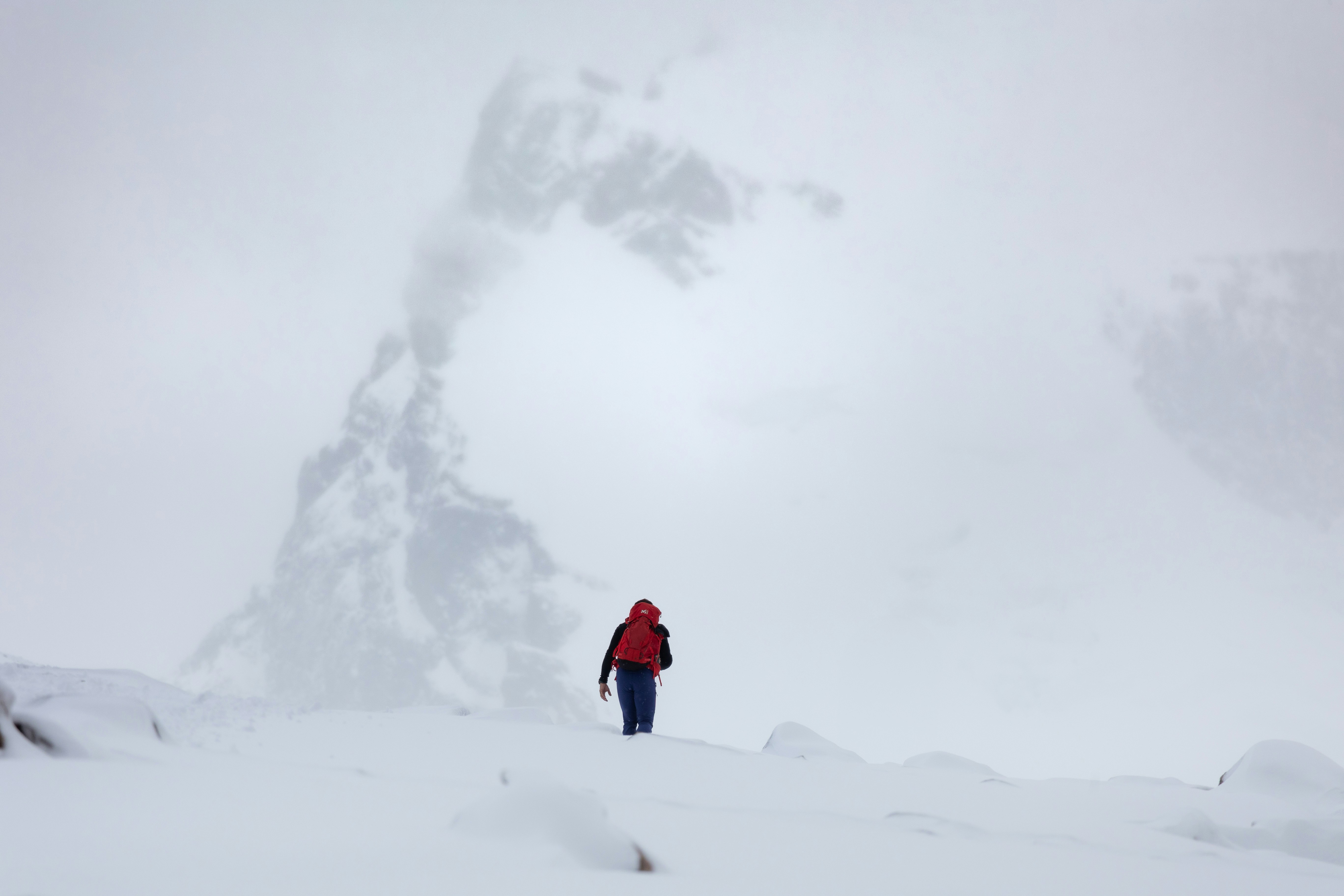 Solitary Ascent Amidst the Mist