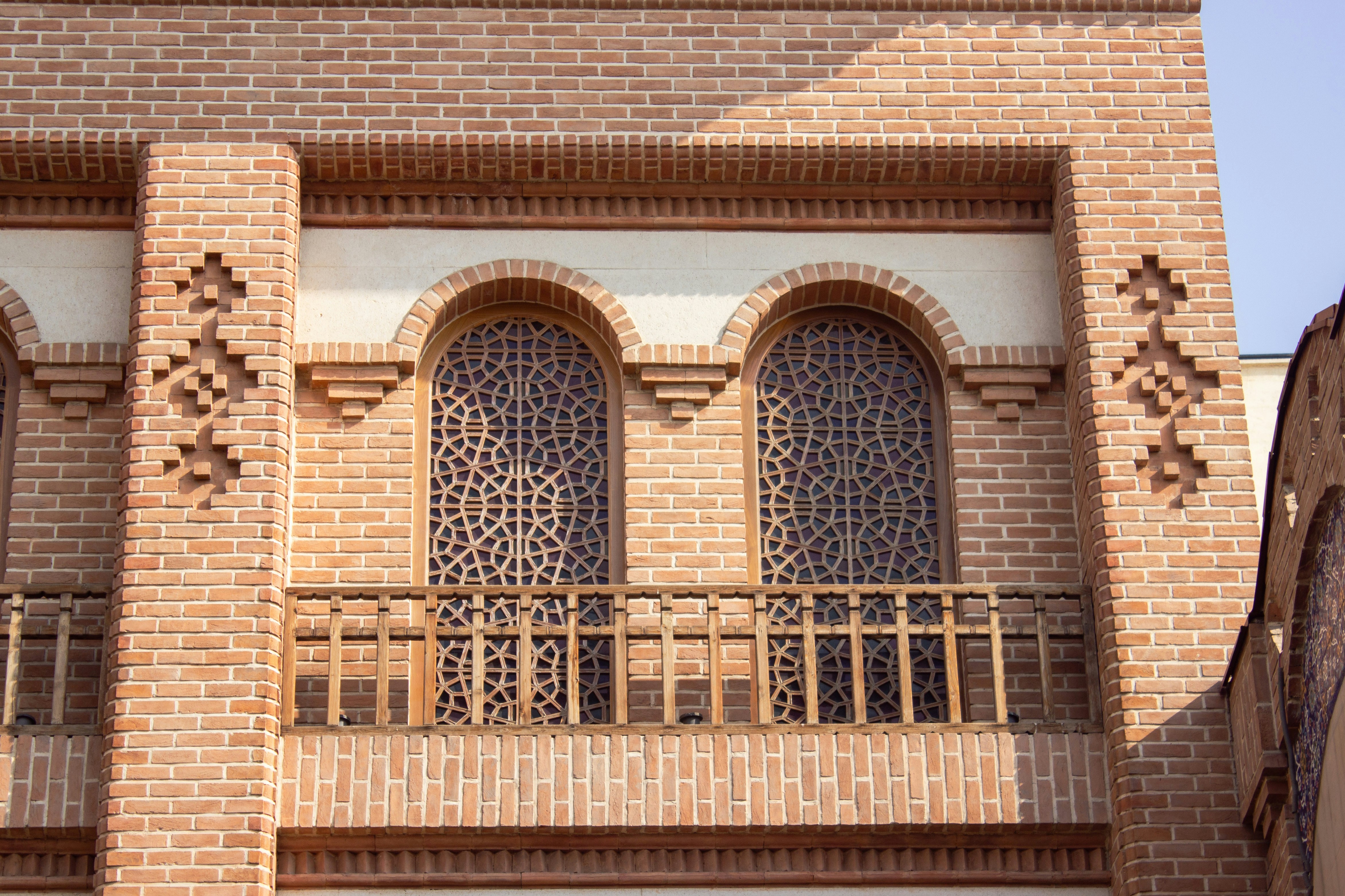 Sunlit Brick Arches Framing Lattice Windows