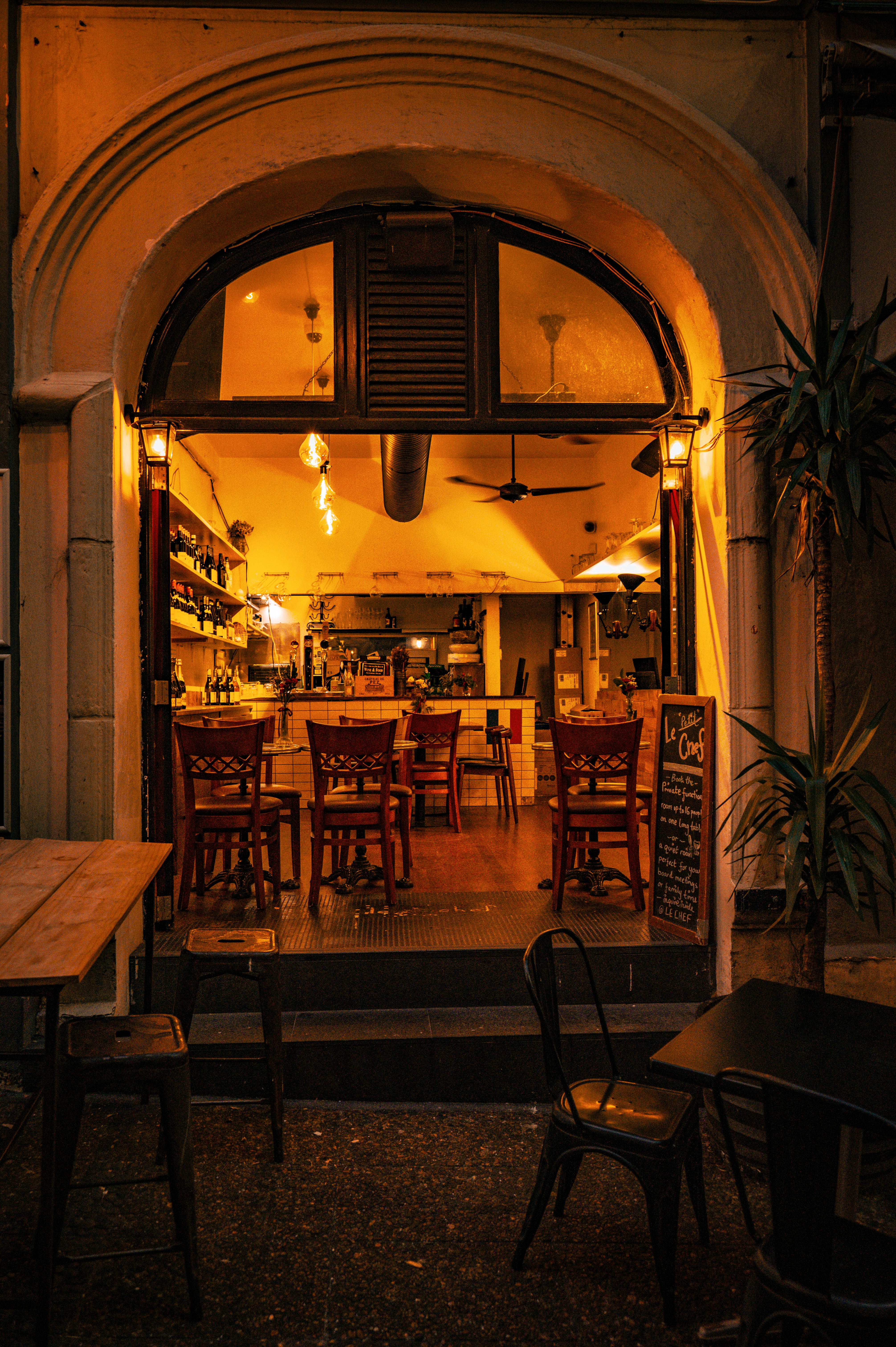 A small restaurant on the side of a street