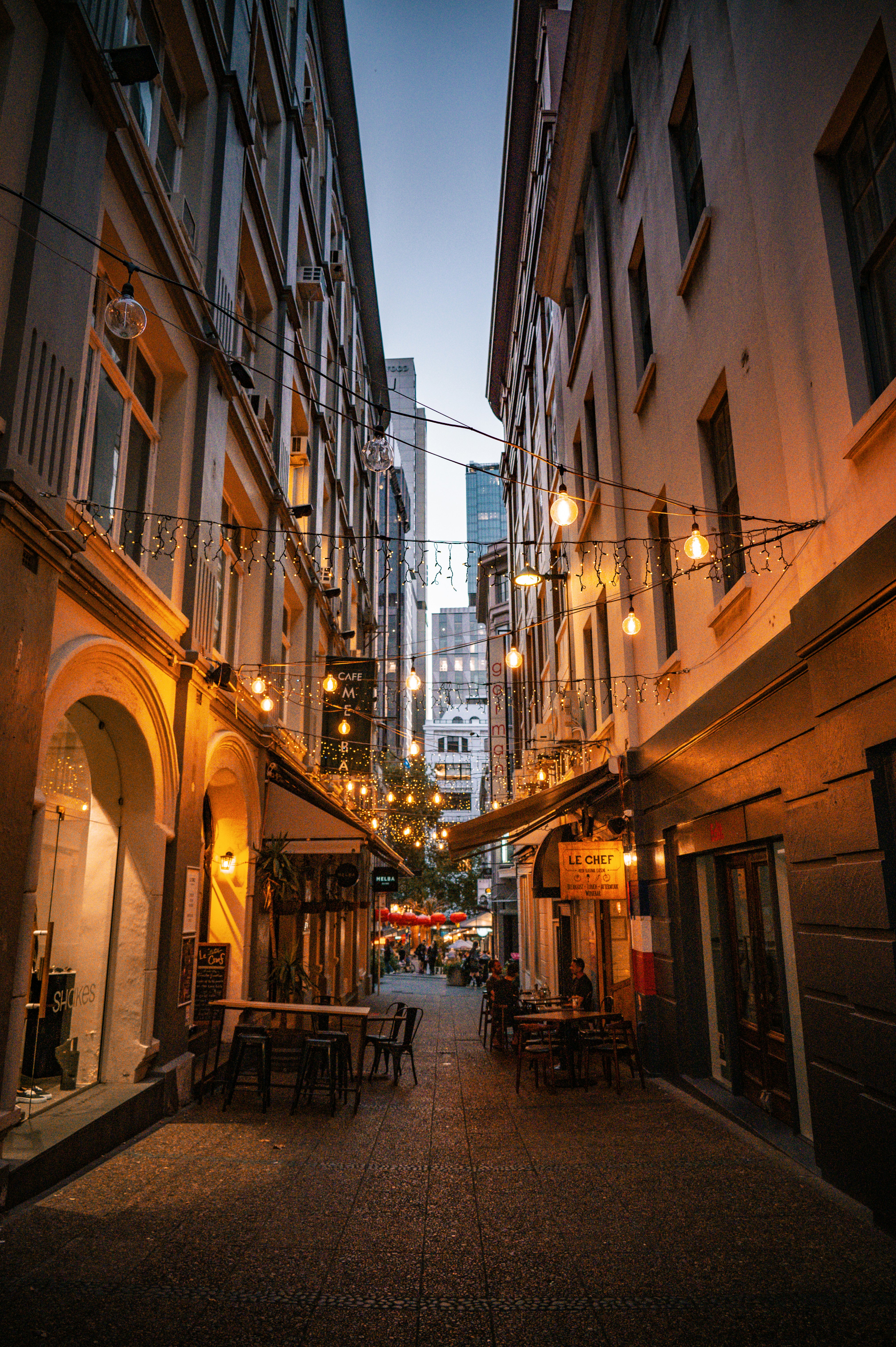 Dusk Lanterns Over a Narrow City Alley