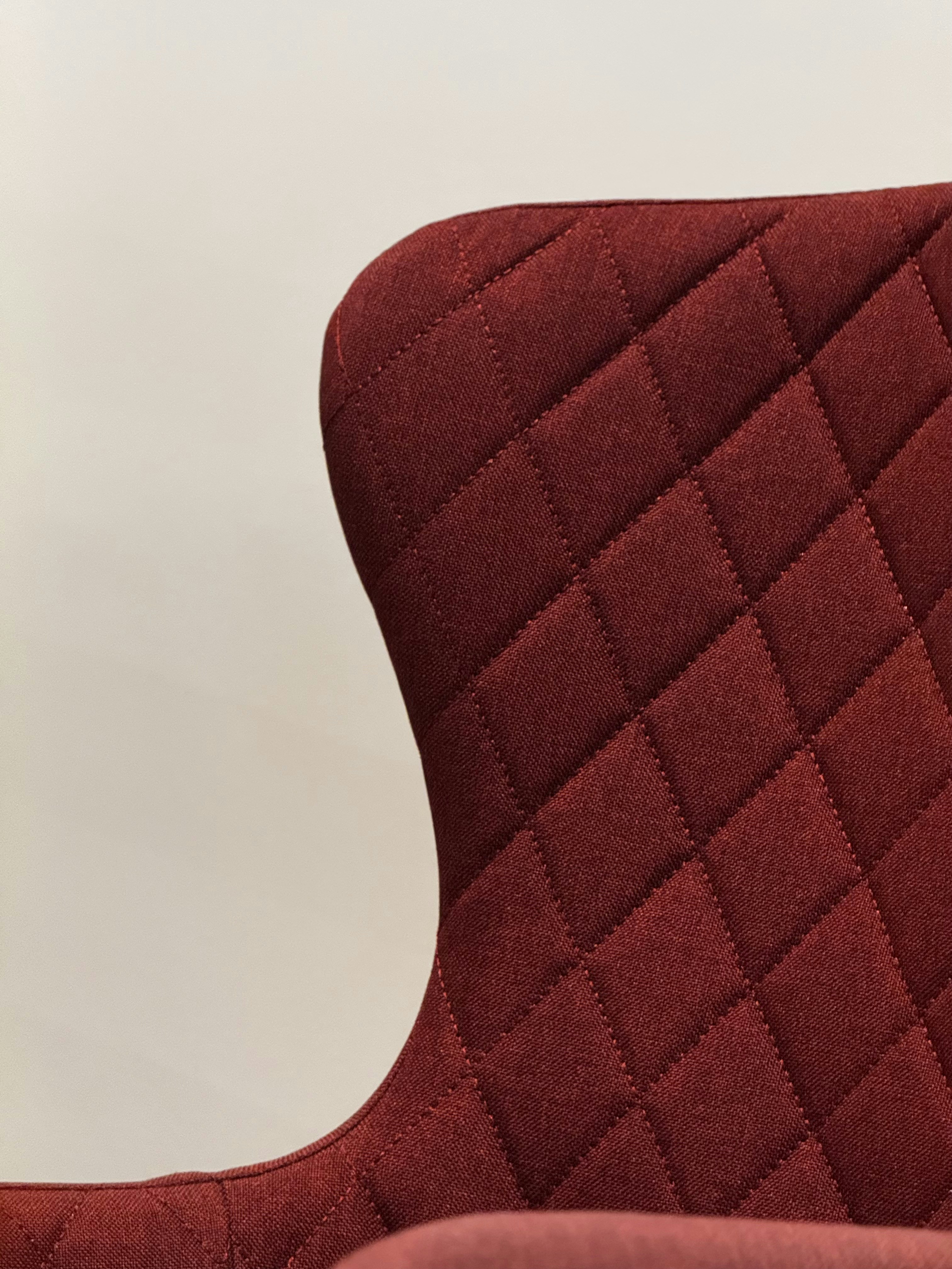 Quilted red chair back against a beige wall. photo – Free Abstract ...