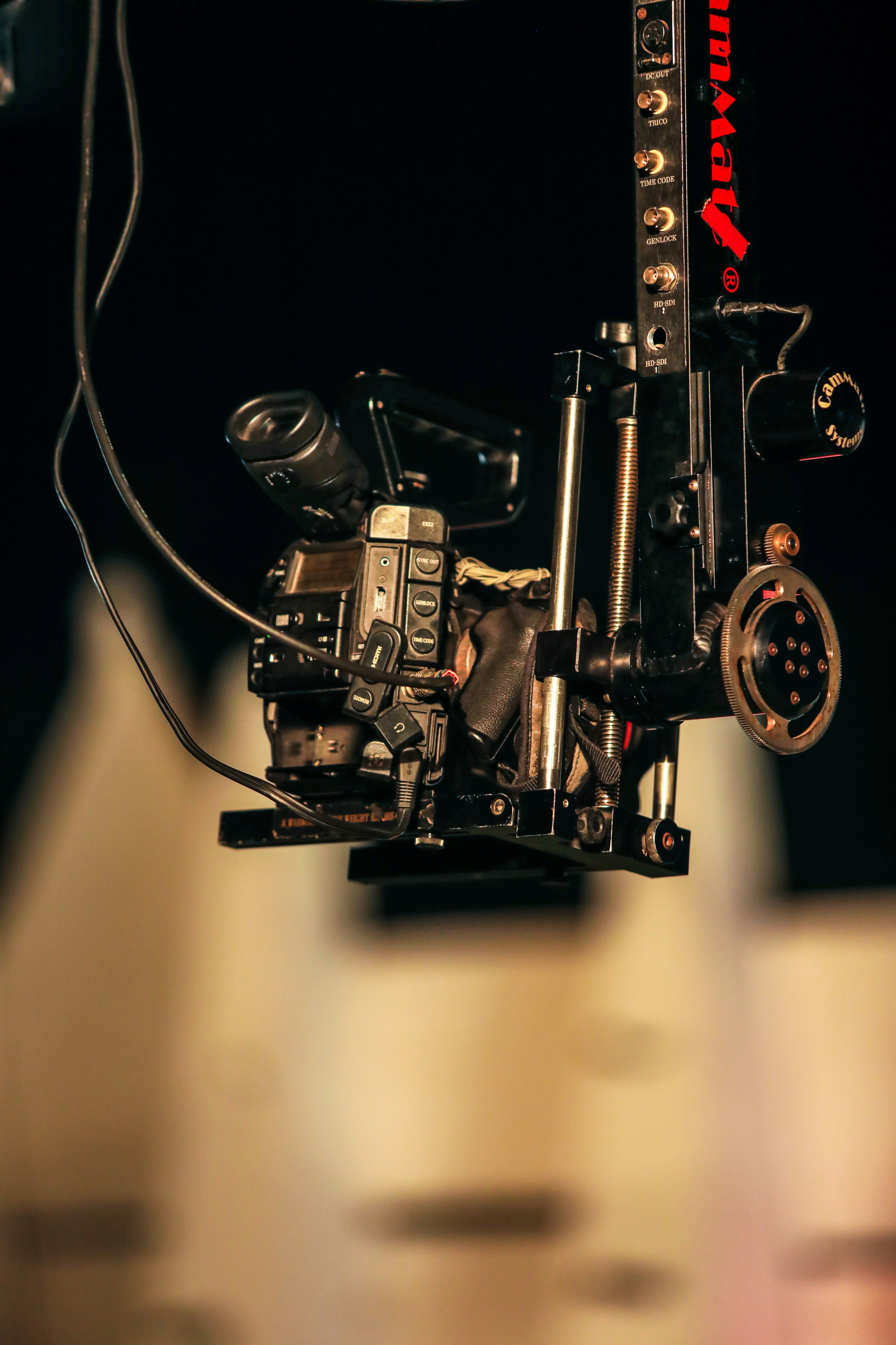 A Canon EOS 5D Mark IV suspended from a rig, showcasing its advanced filming setup in a studio environment.
