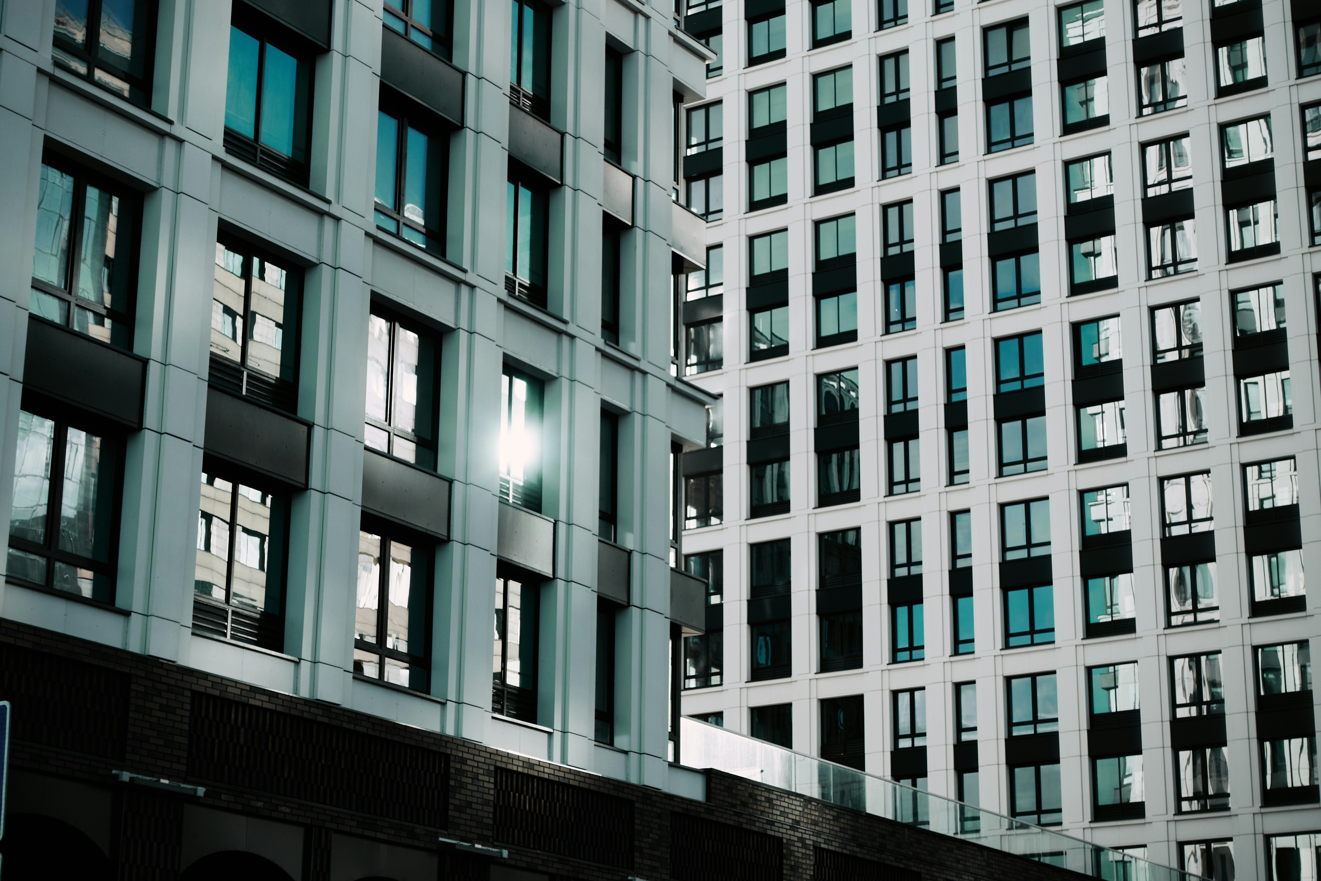 Modern buildings with many windows and a sunny highlight. photo – Free ...