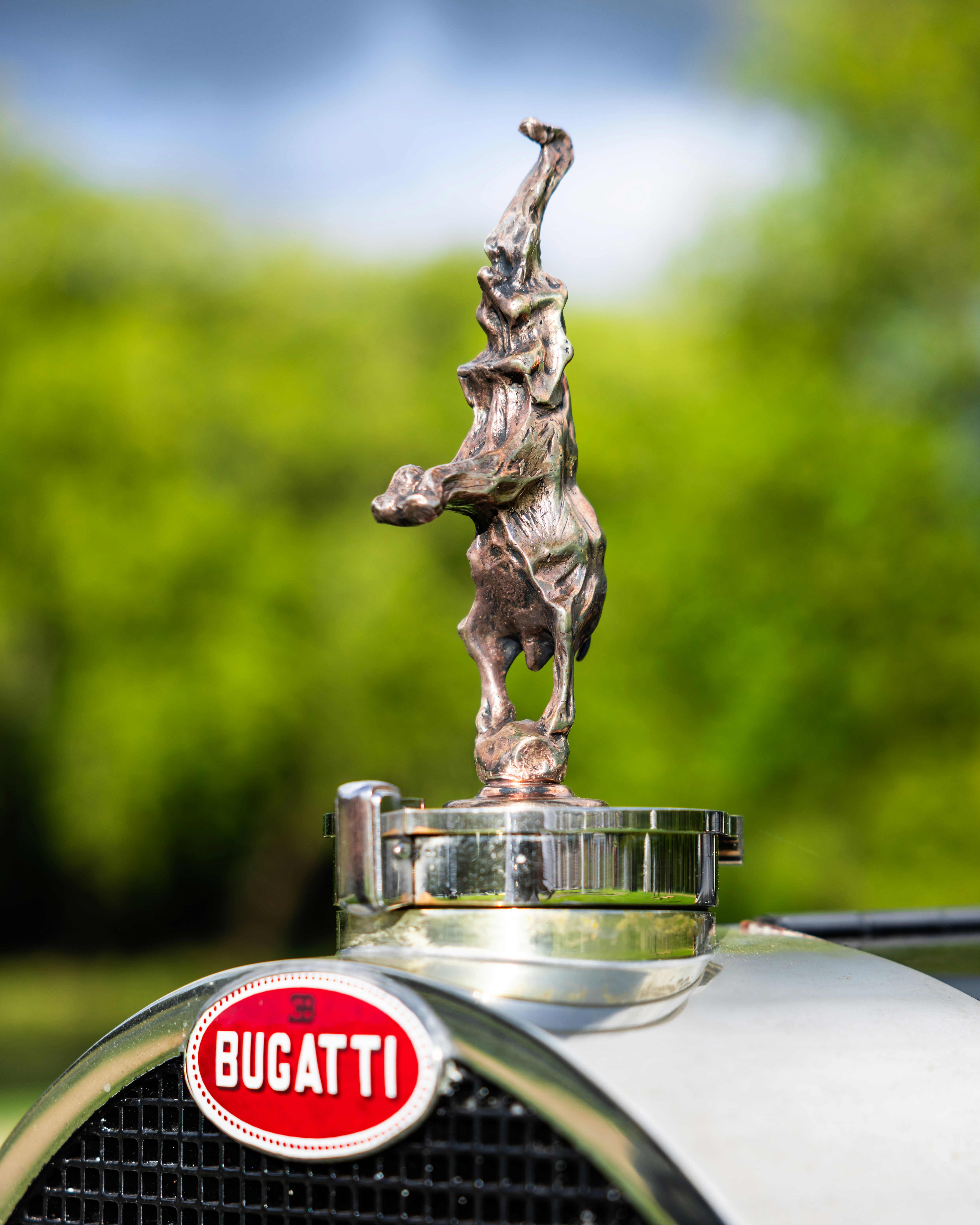 A bugatti hood ornament is prominently displayed. photo – Free ...