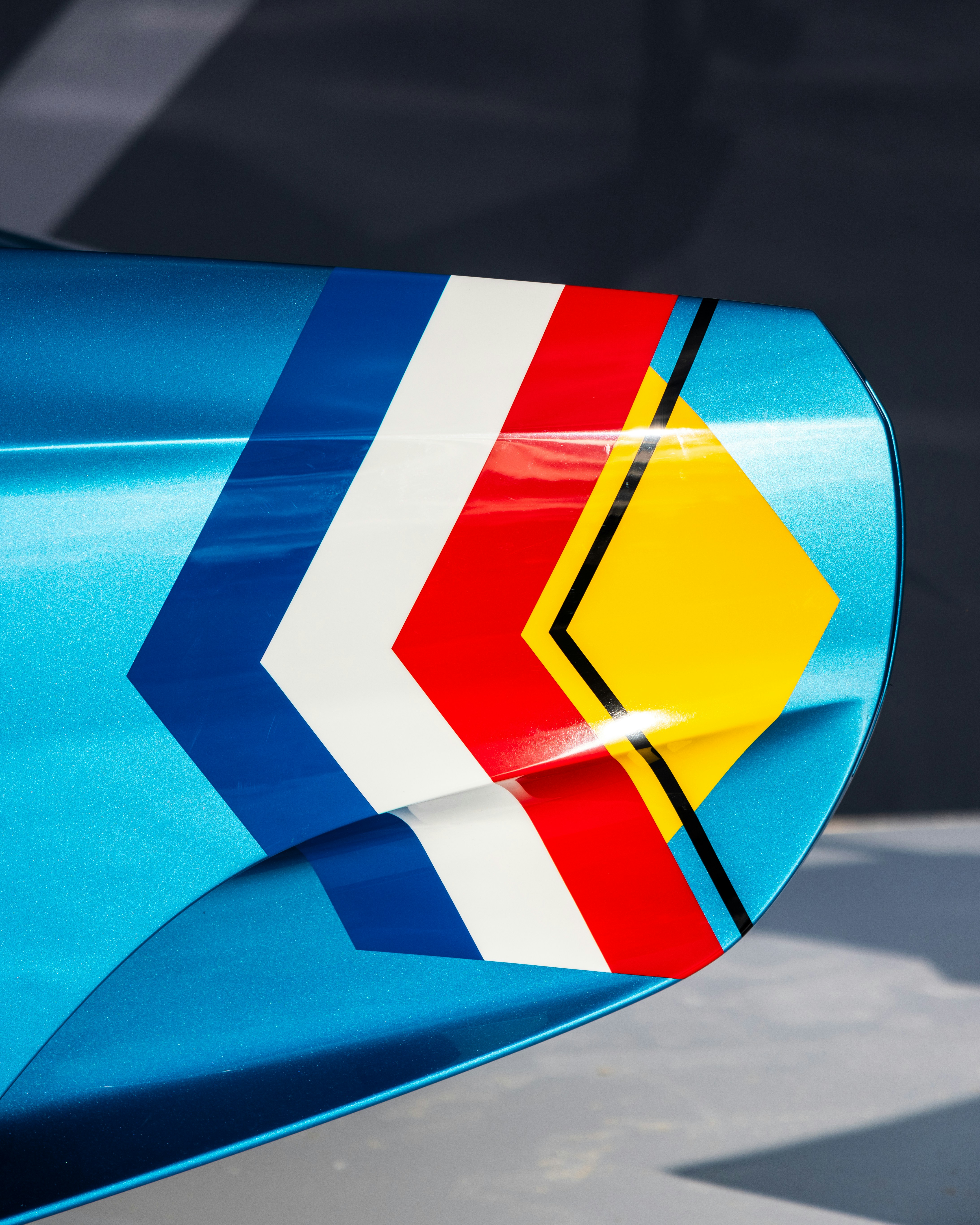 Blue car detail shows colorful, geometric accents. photo – Free ...