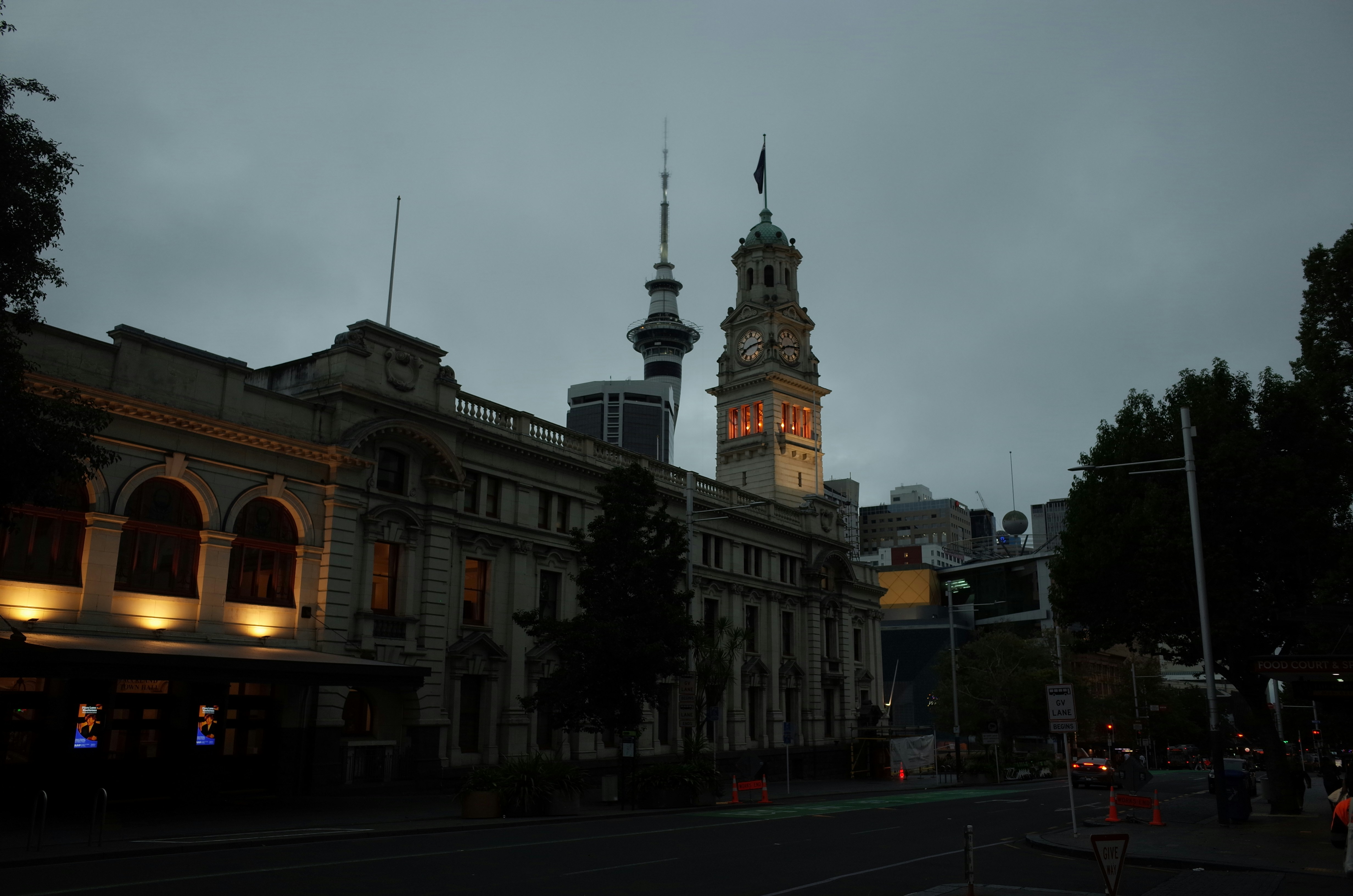 Auckland town hall with sky tower at dusk. photo – Free Car Image on ...