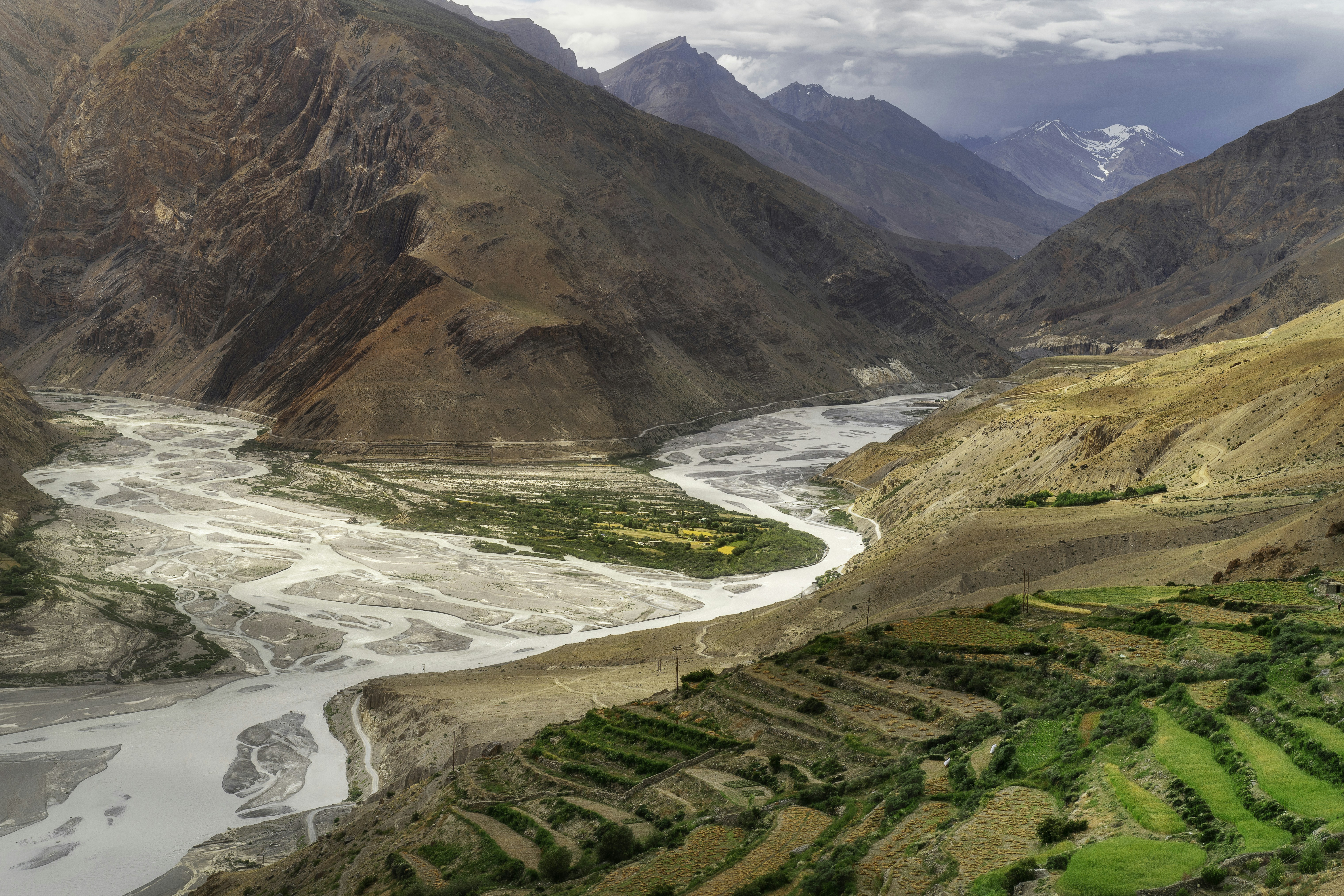 Mountains and a river carve through the landscape. photo – Free Travel ...