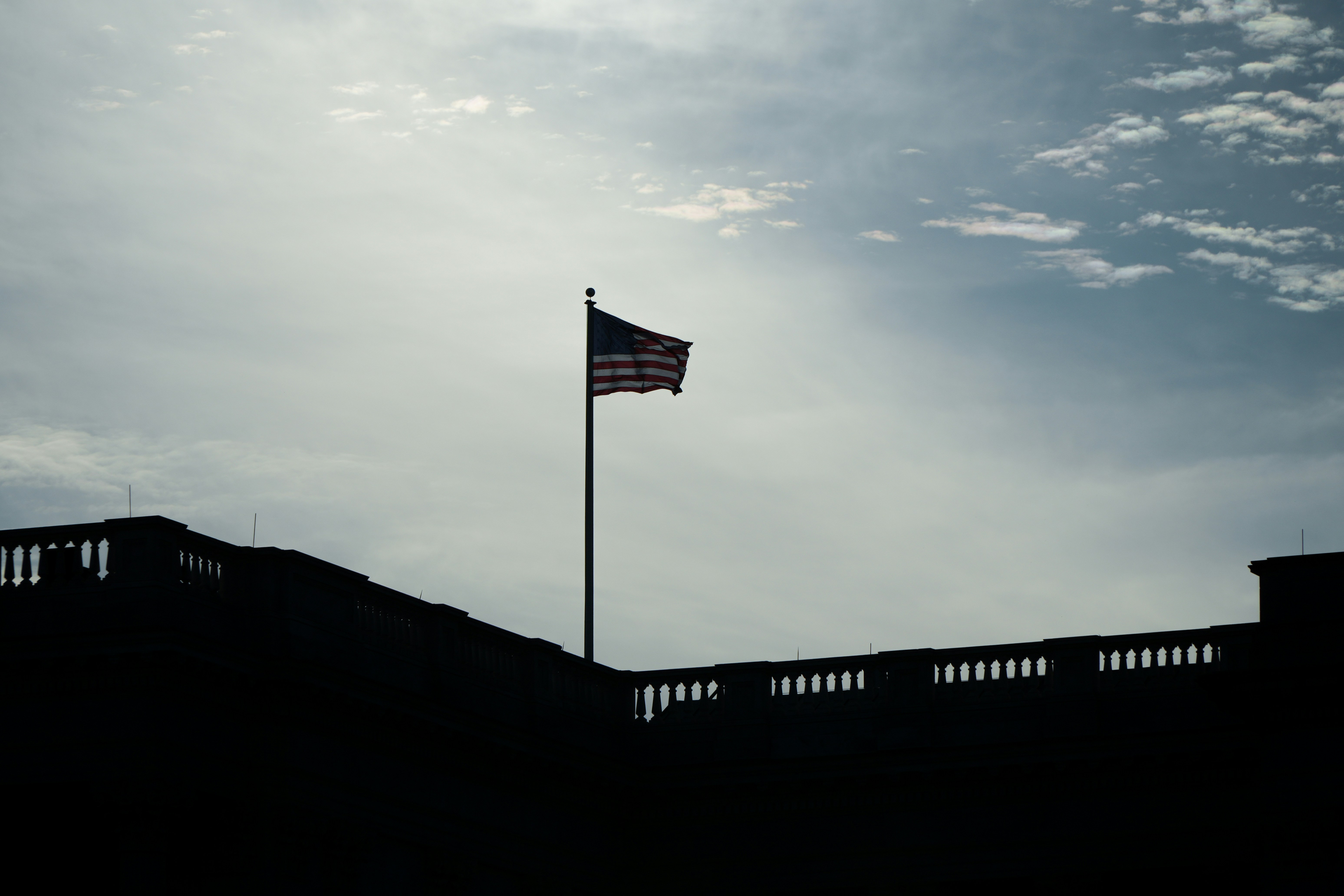 Whispers of Democracy: The Flag at Dusk