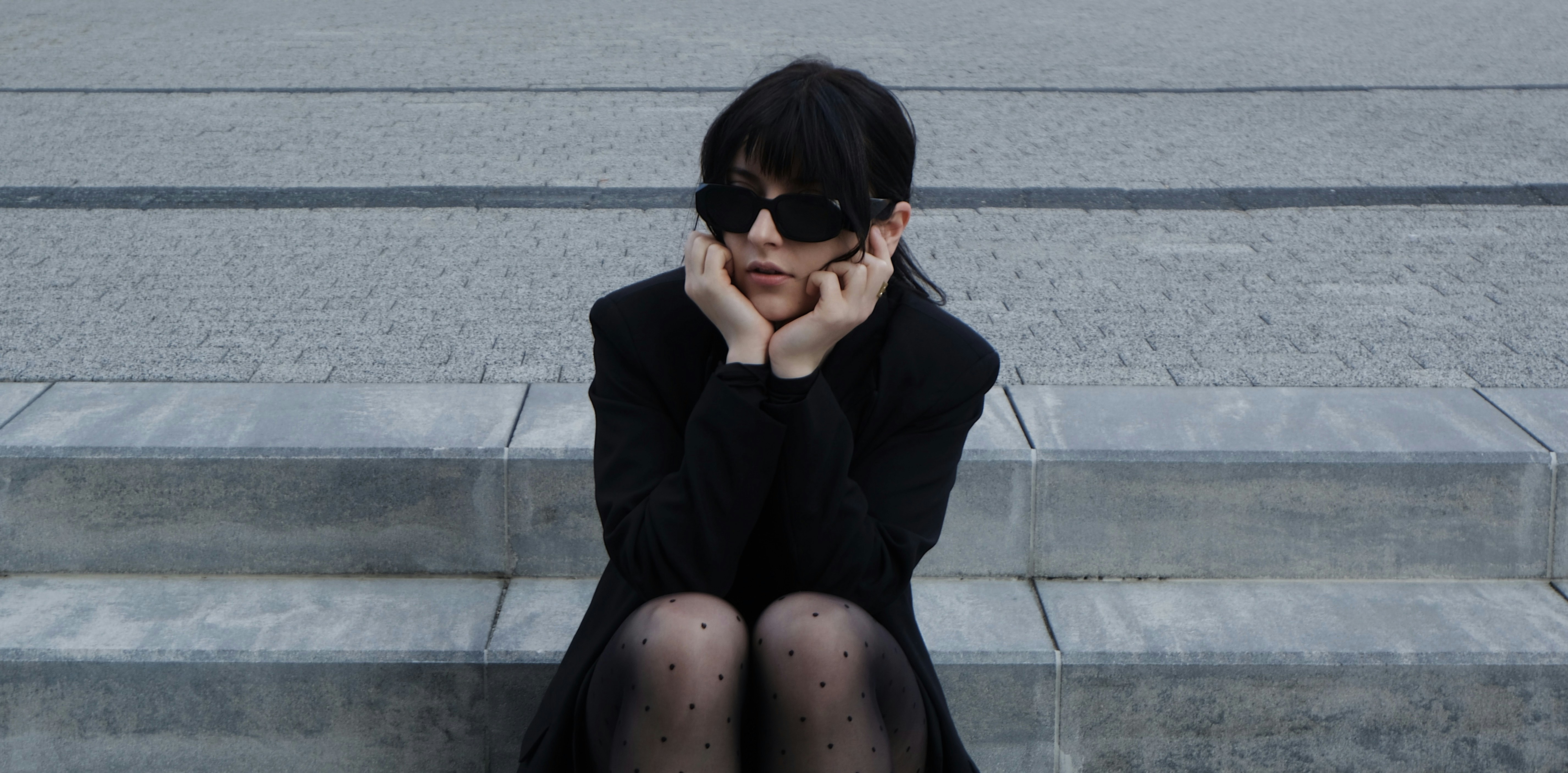 Contemplative Elegance on Urban Steps
