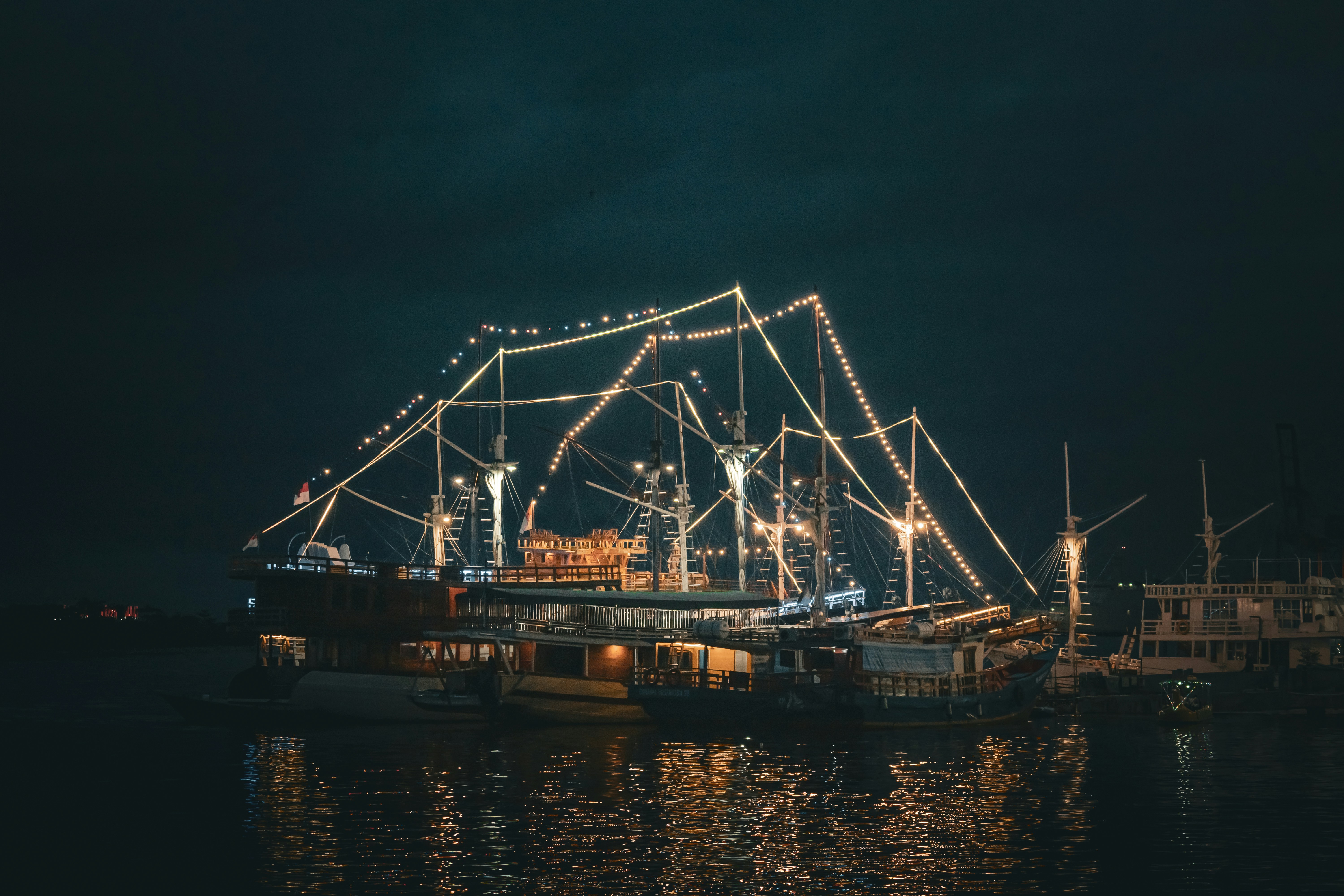 Lantern-Lit Rigging Over a Quiet Harbor
