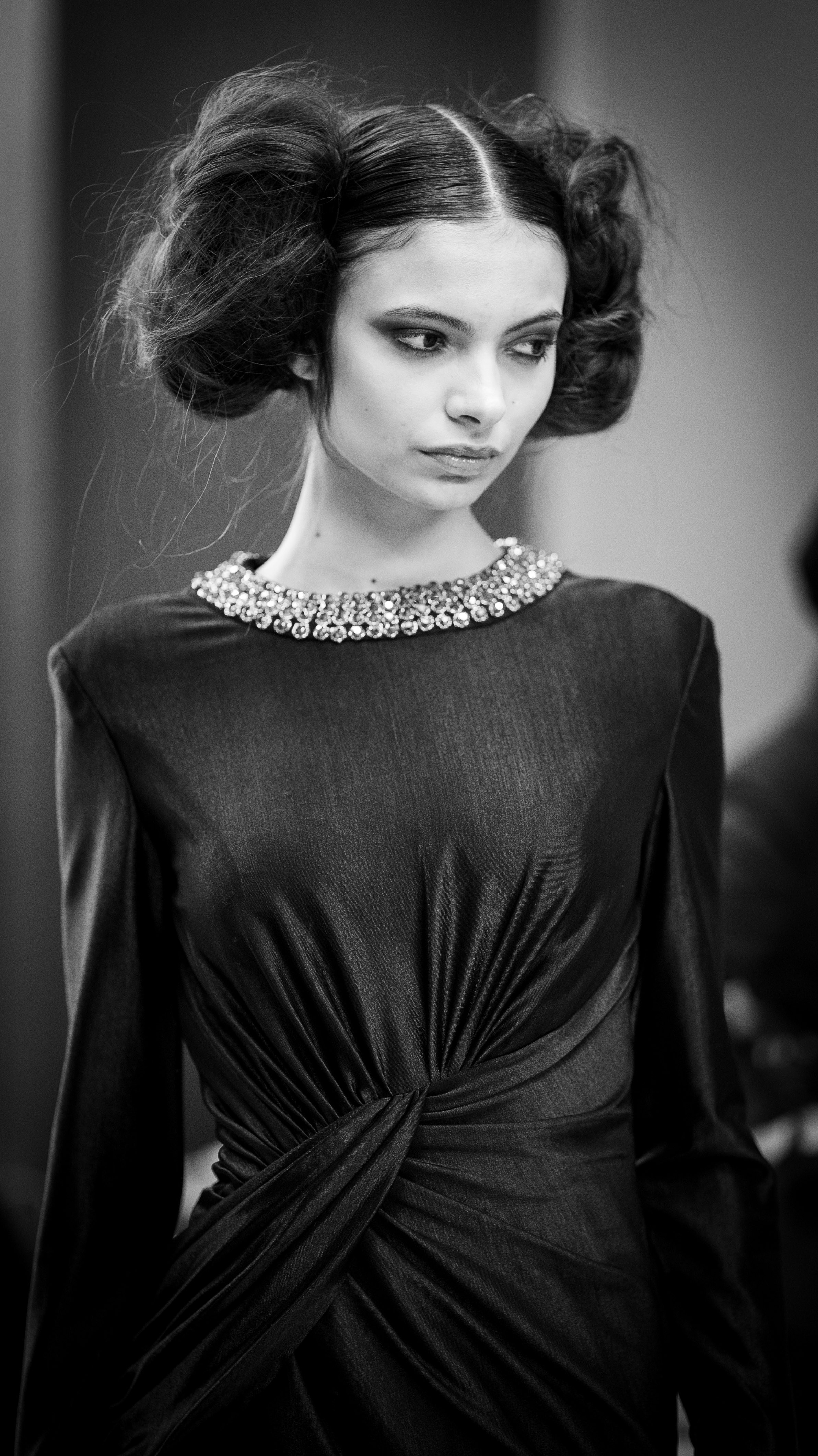 A model in a black dress and elaborate hairstyle. photo – Free Model ...