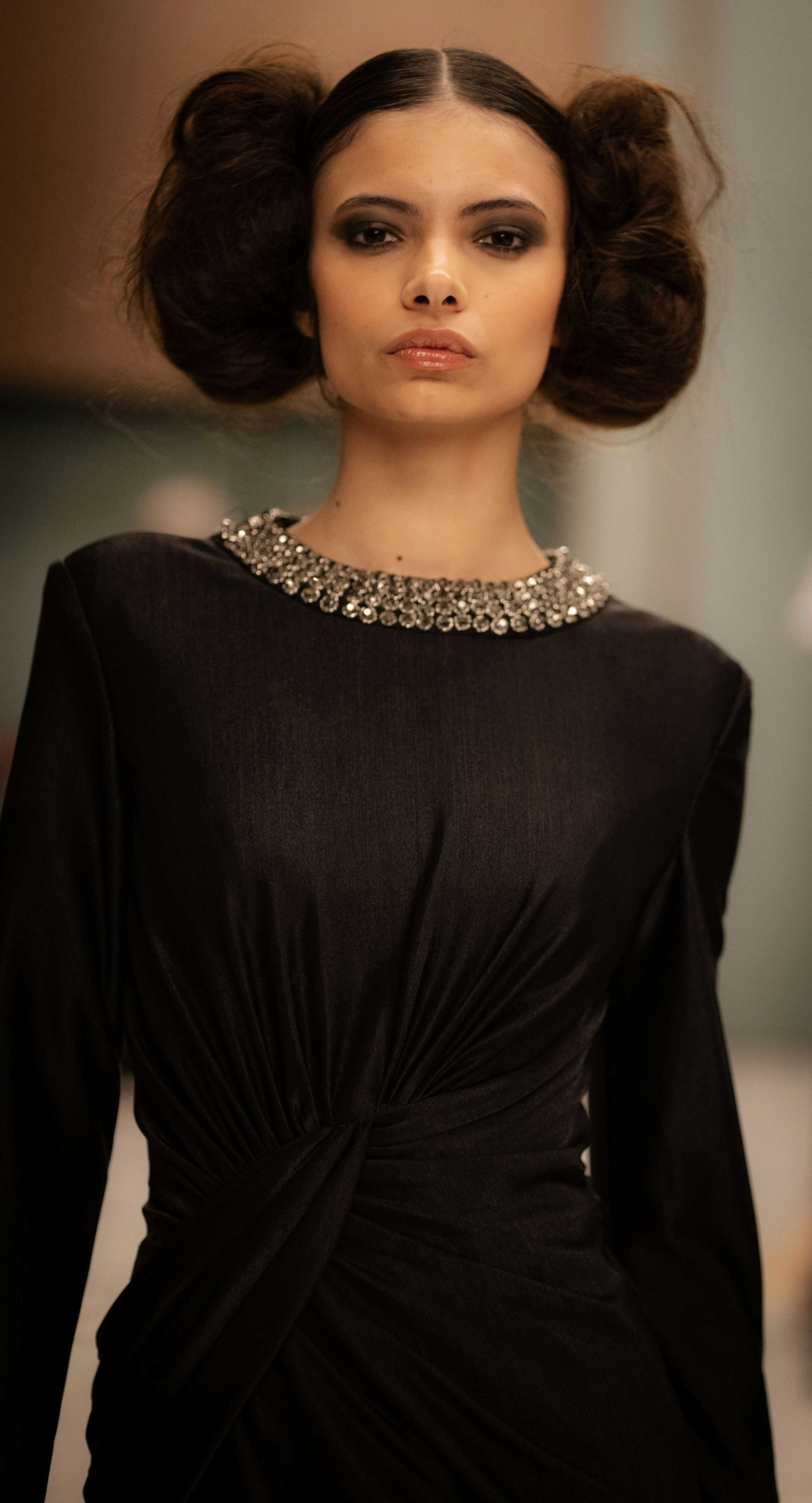 A woman models a black dress with embellished neckline. photo – Free ...