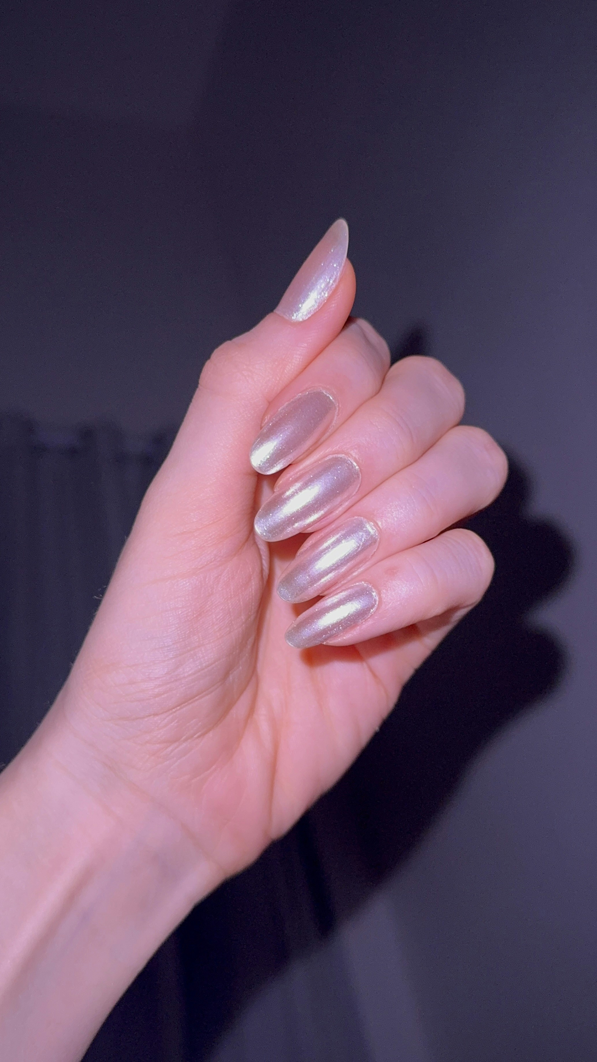 Opalescent Elegance in Handcrafted Nail Art