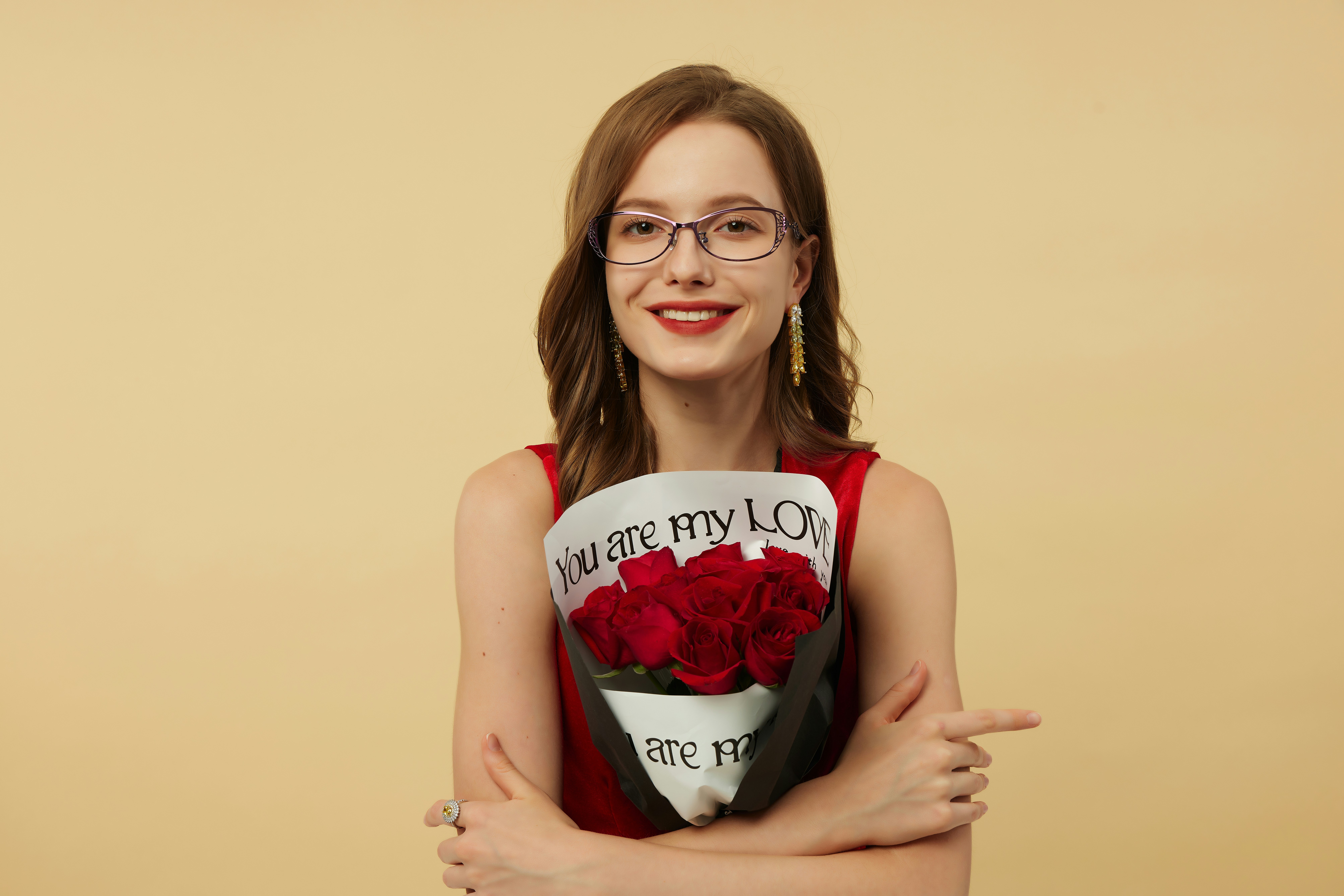 Woman smiles, holding a bouquet of red roses. photo – Free Flower Image ...