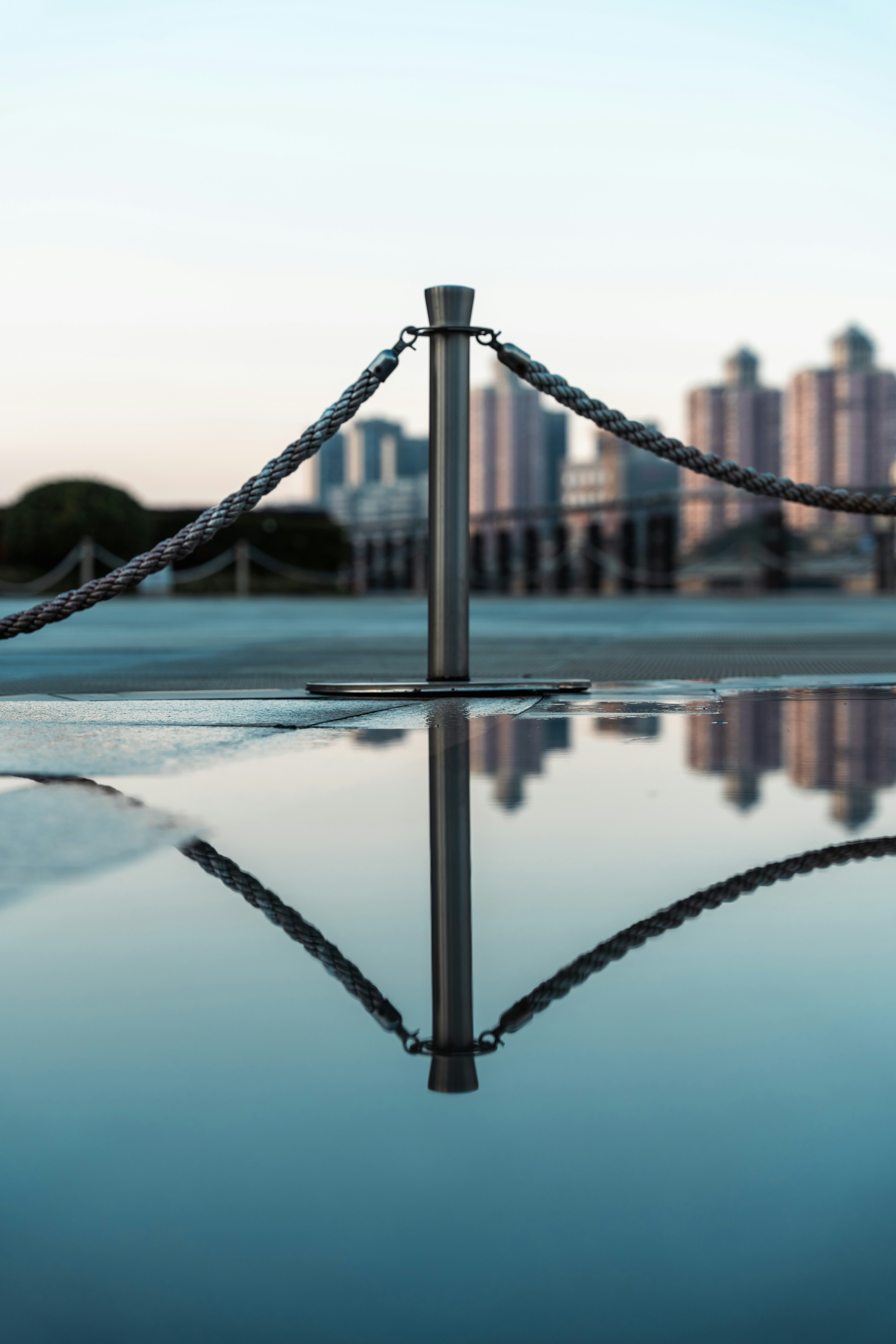 Reflection Barrier: A Central Pier with Receding Rope Lines