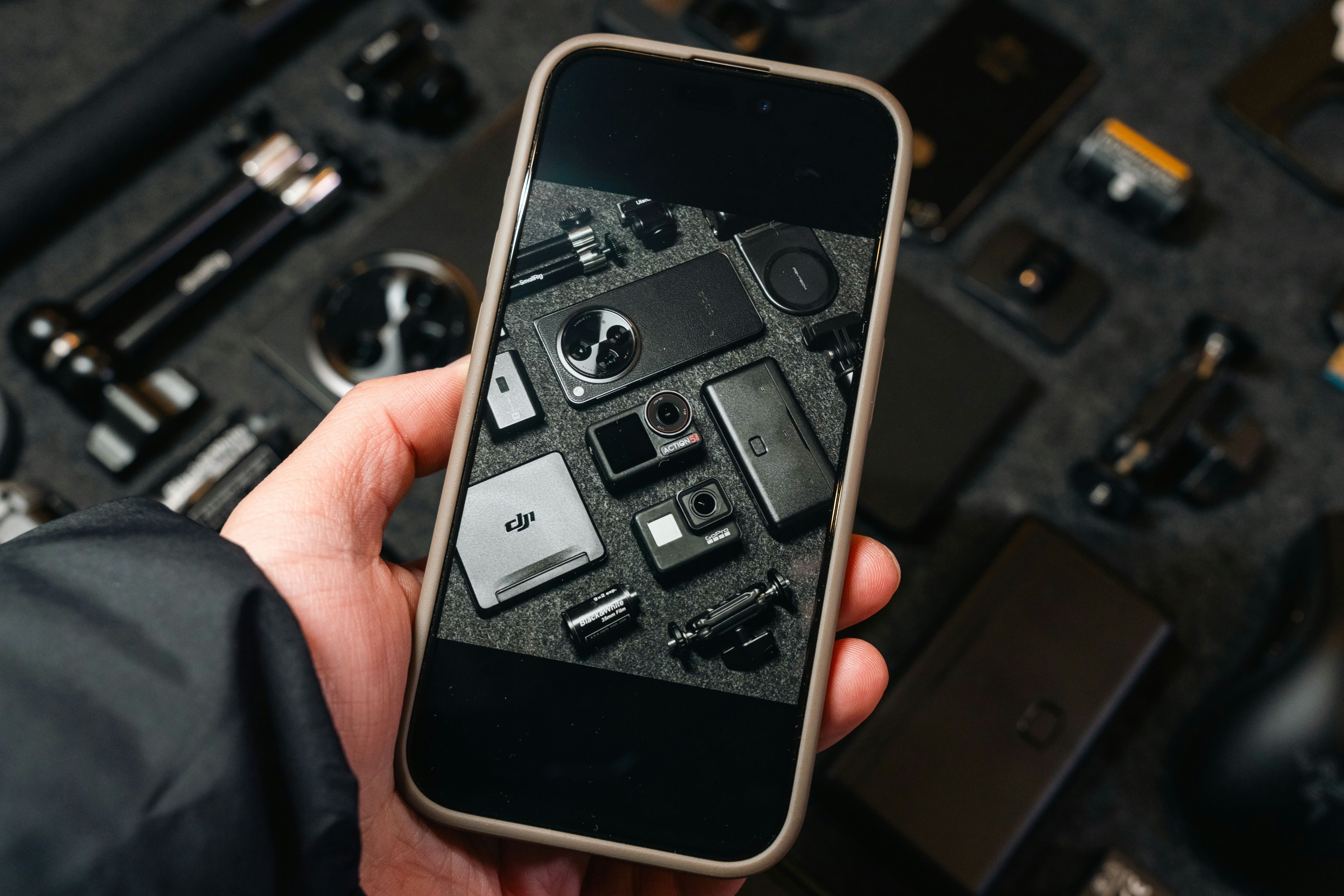 Phone displaying a photo of various tech gadgets. photo – Free Phone ...