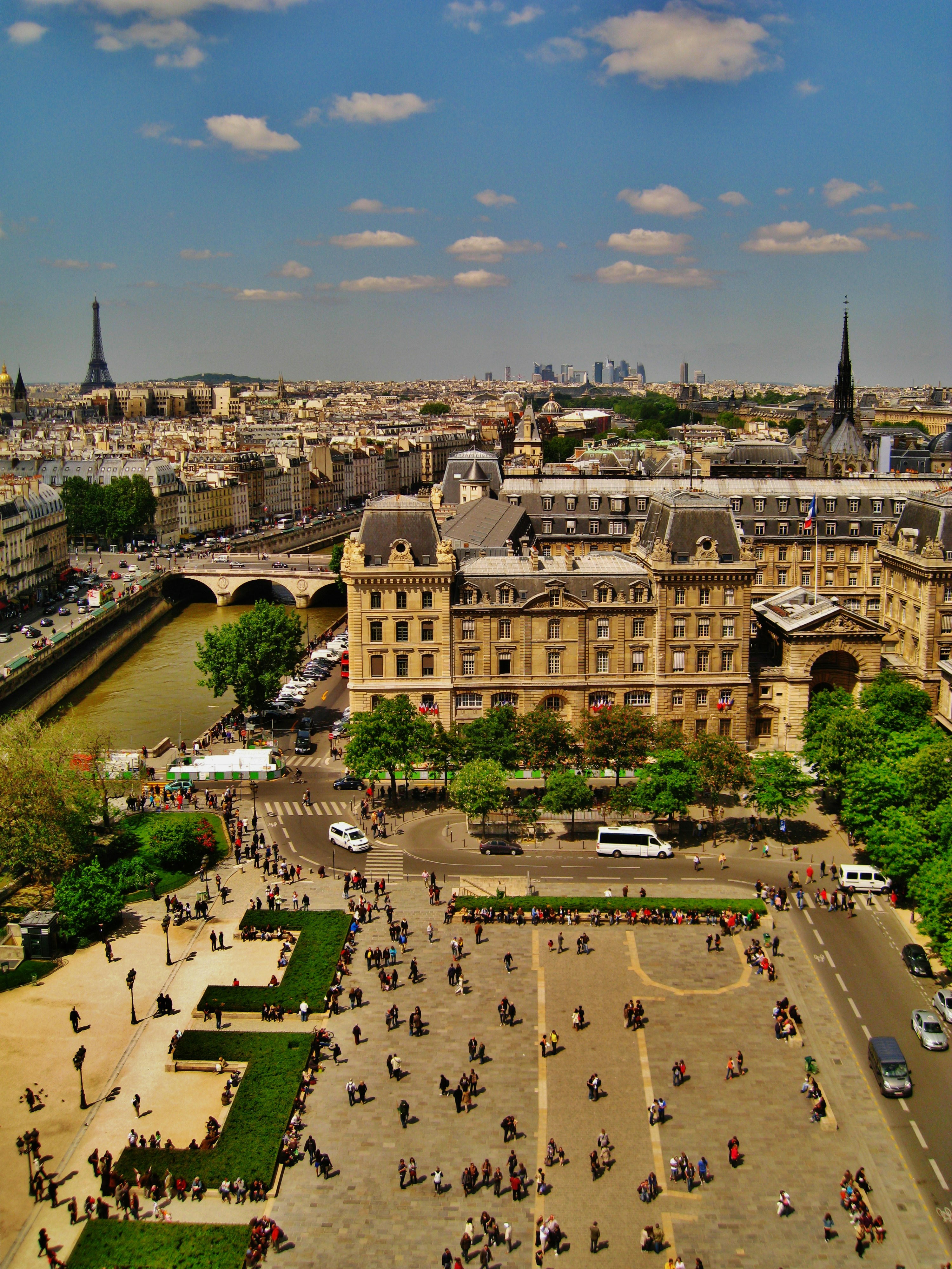 Sunlit Parisian Plaza: A Bird's-Eye Overlook of the Louvre and River Seine