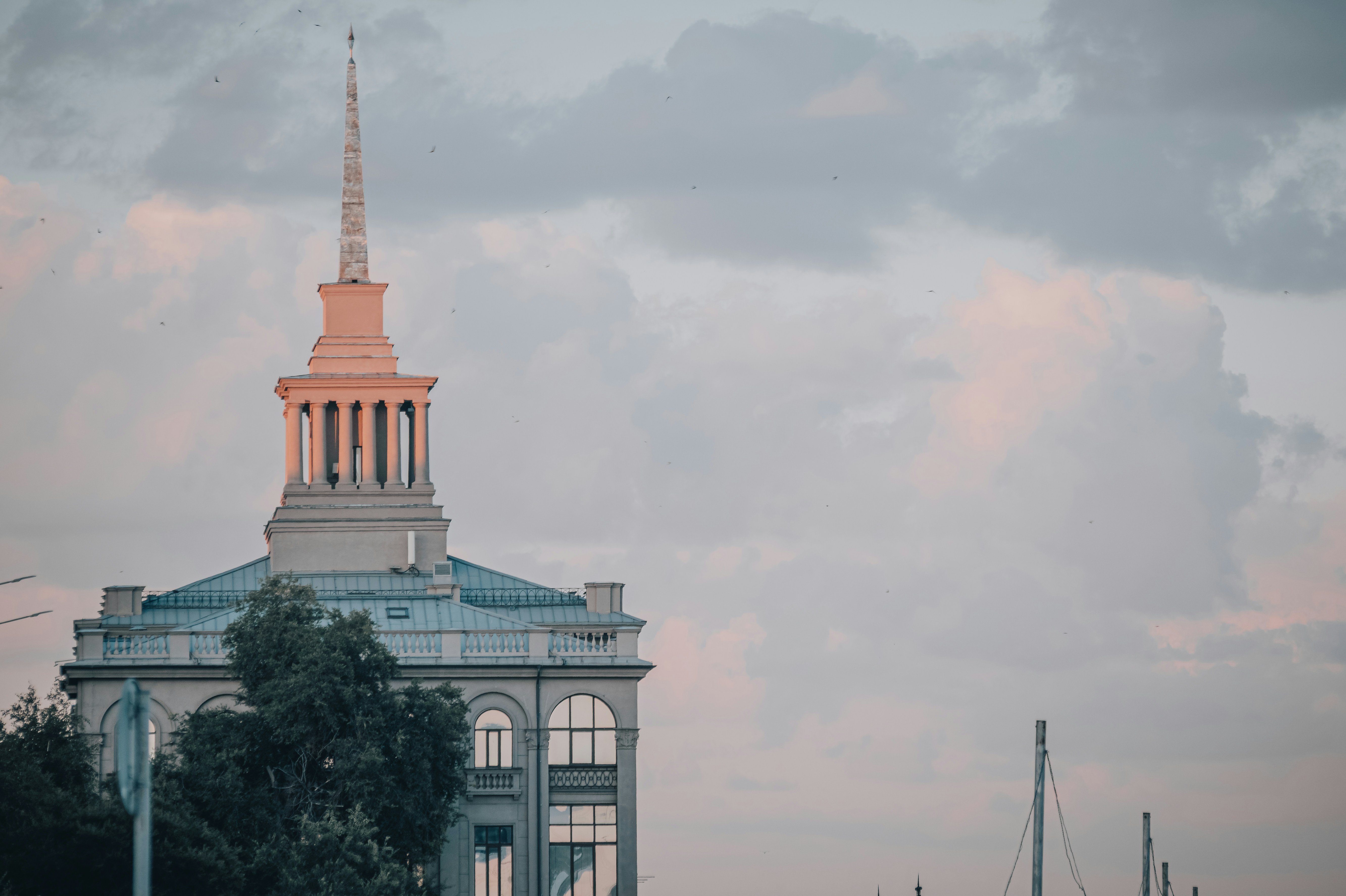 A tower with a spire against a cloudy sky. photo – Free Architecture ...