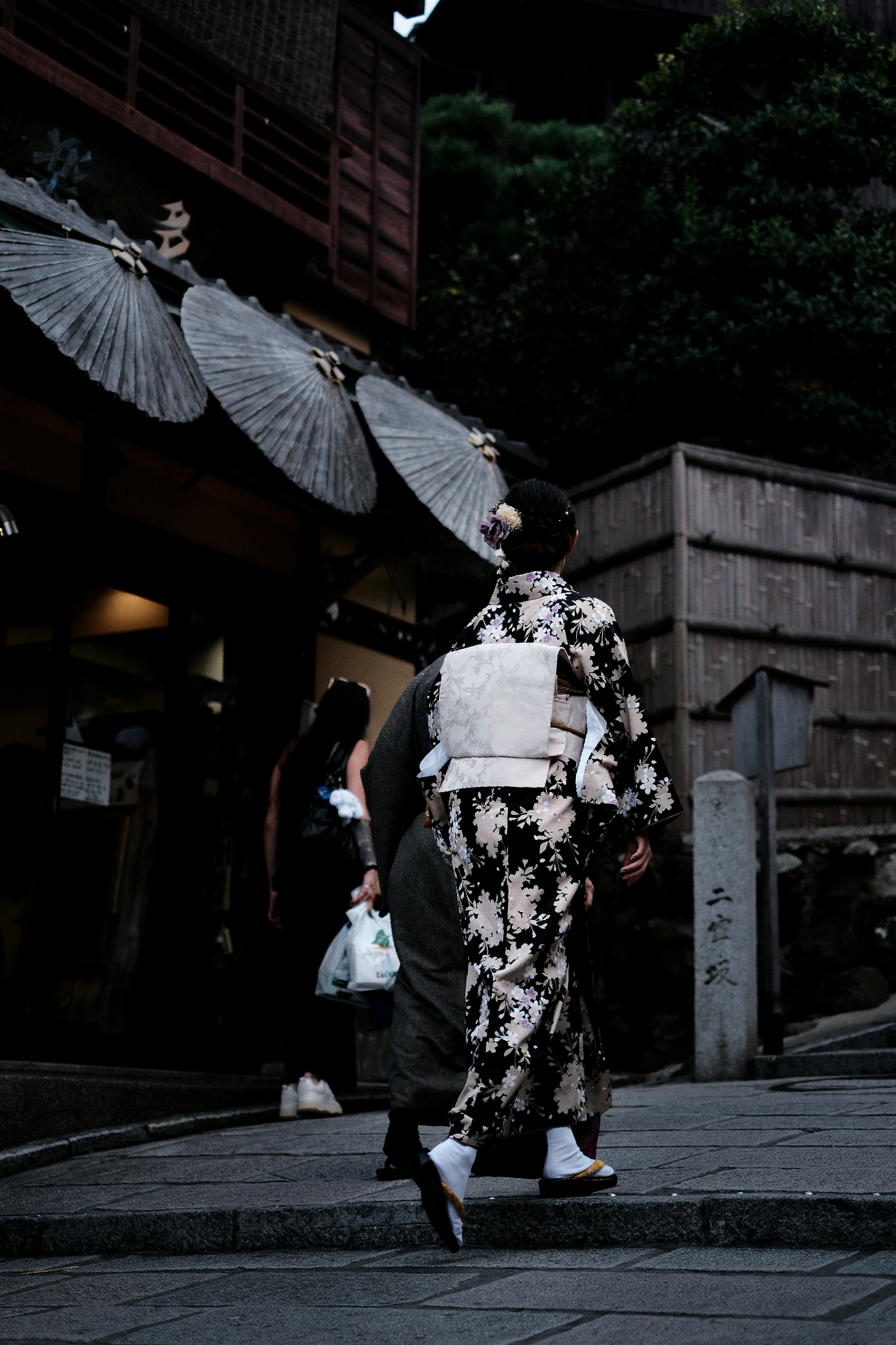 Confident stroll through a quiet shrine in a floral kimono