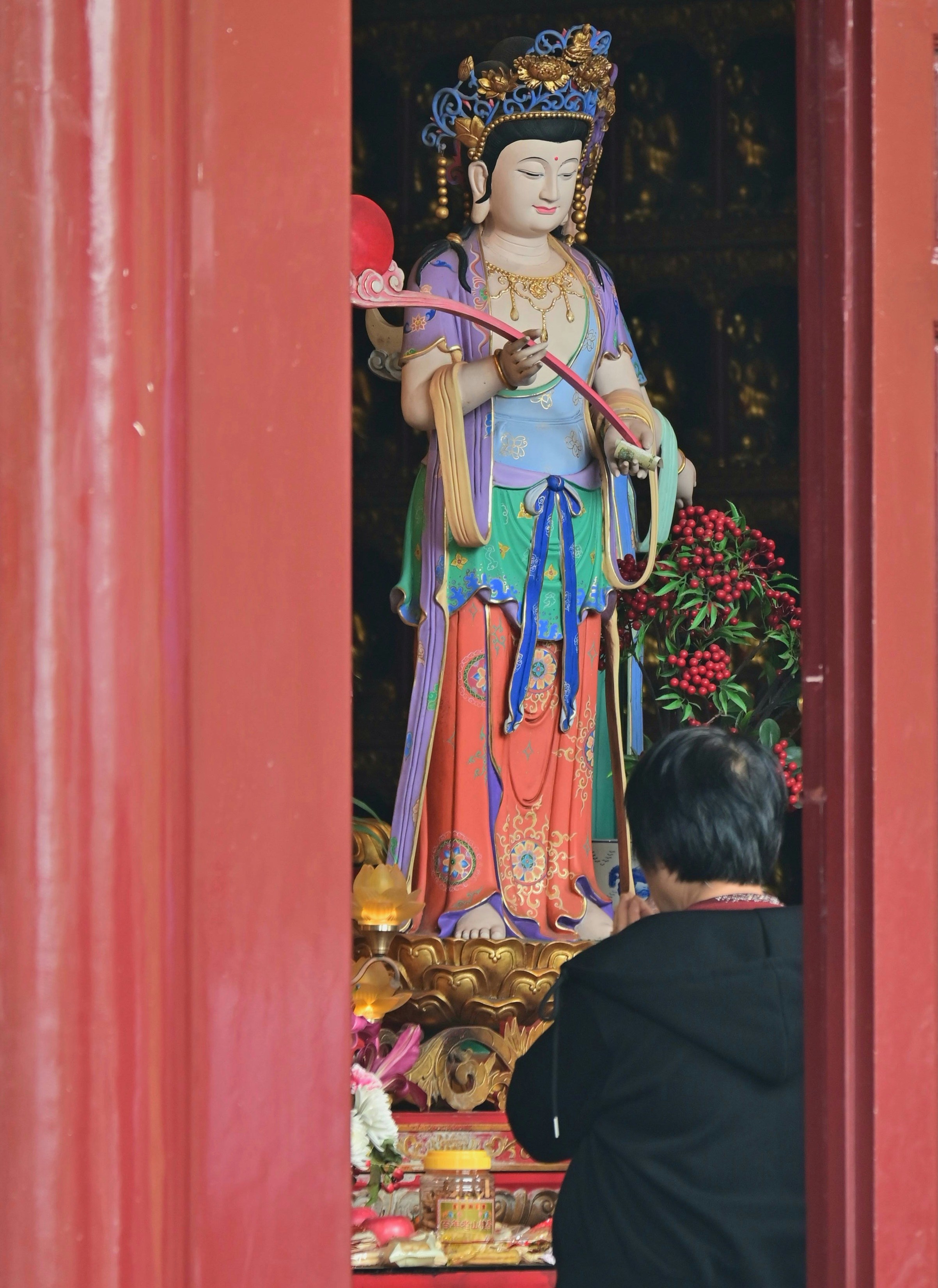 Crimson Gate Reverie: A Bodhisattva Framed by Temple Columns