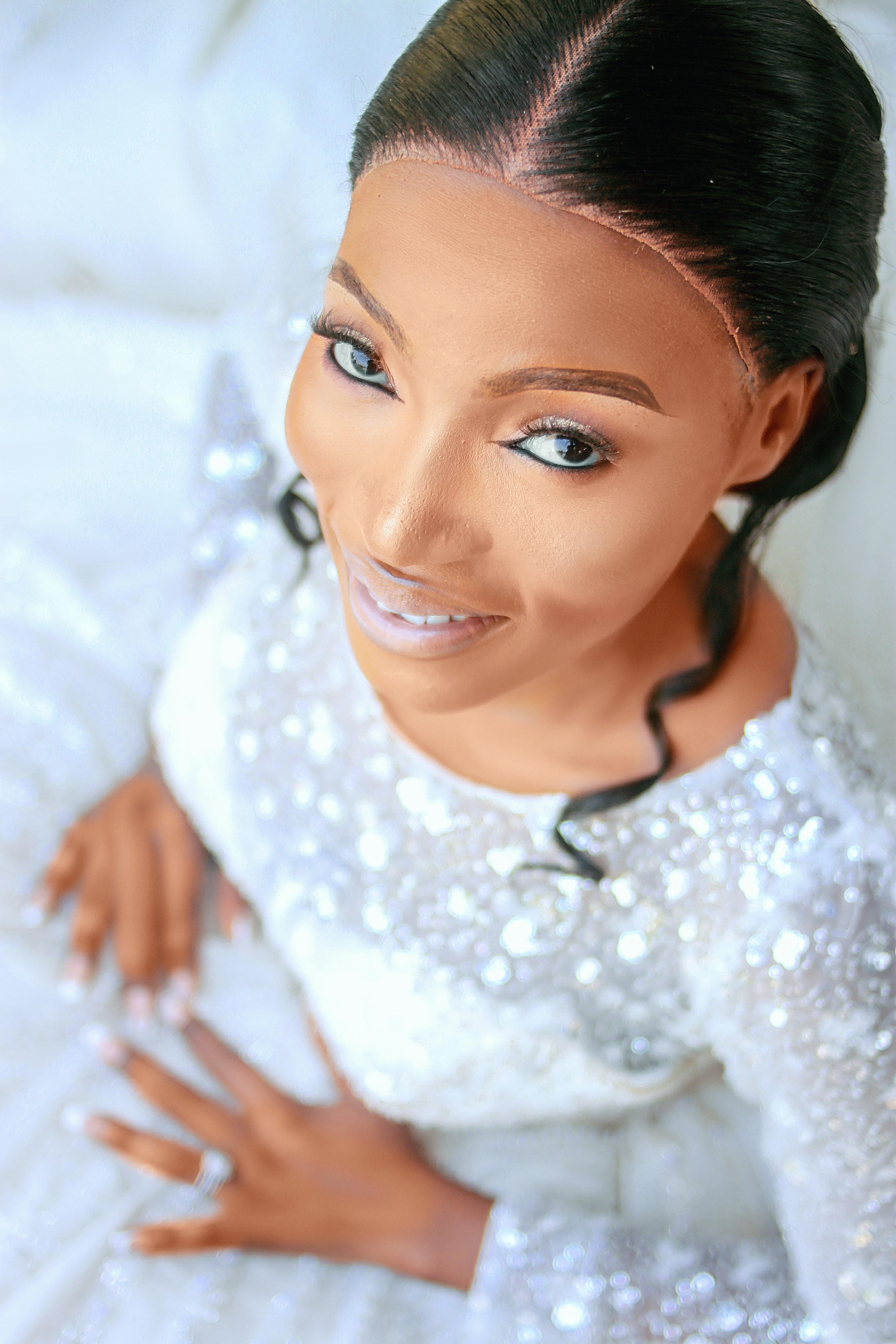 A beautiful bride looks up and smiles. photo – Free Portrait Image on ...