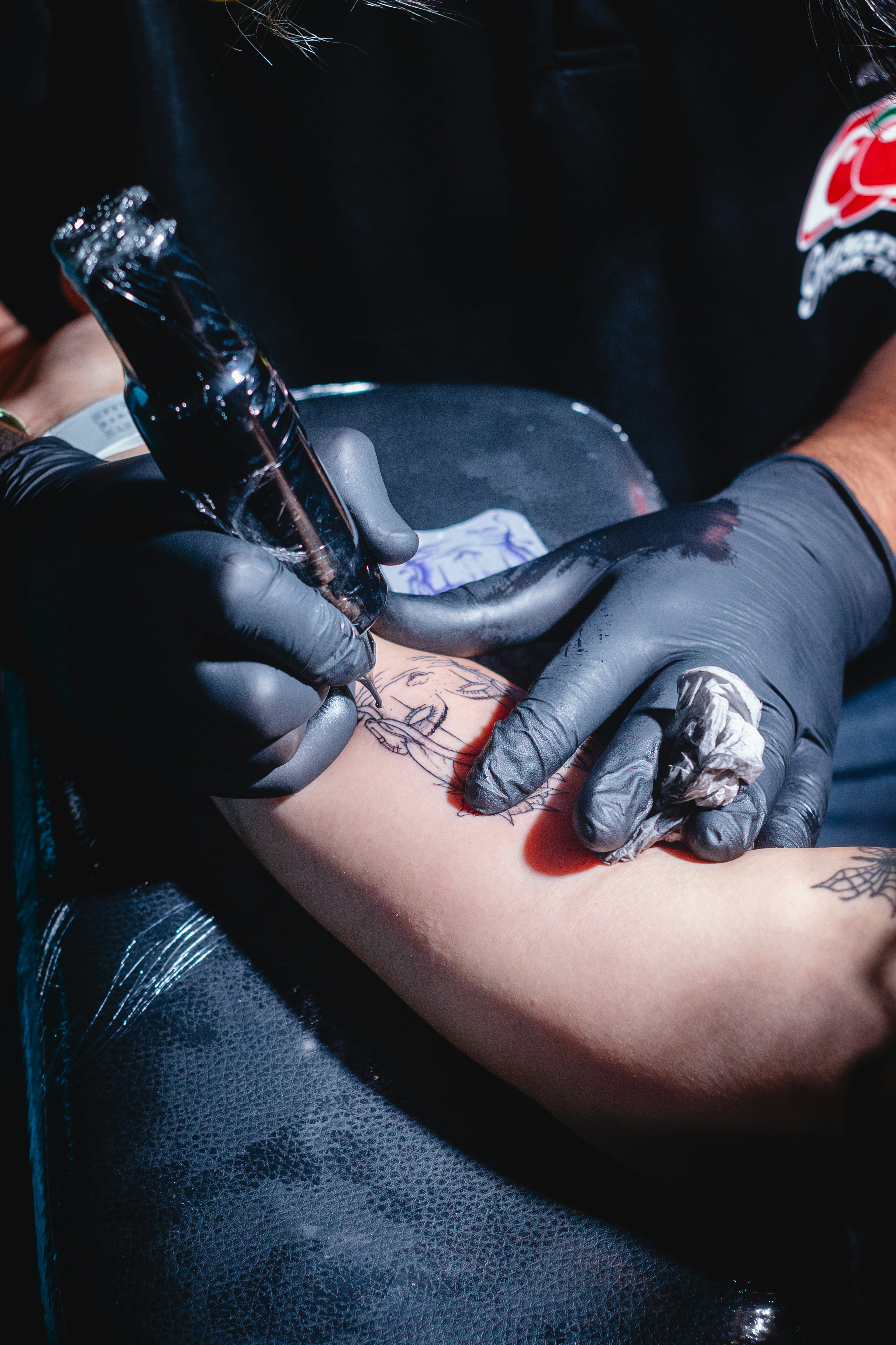 Close-Up Ink: A Tattoo Session in Sharp Focus