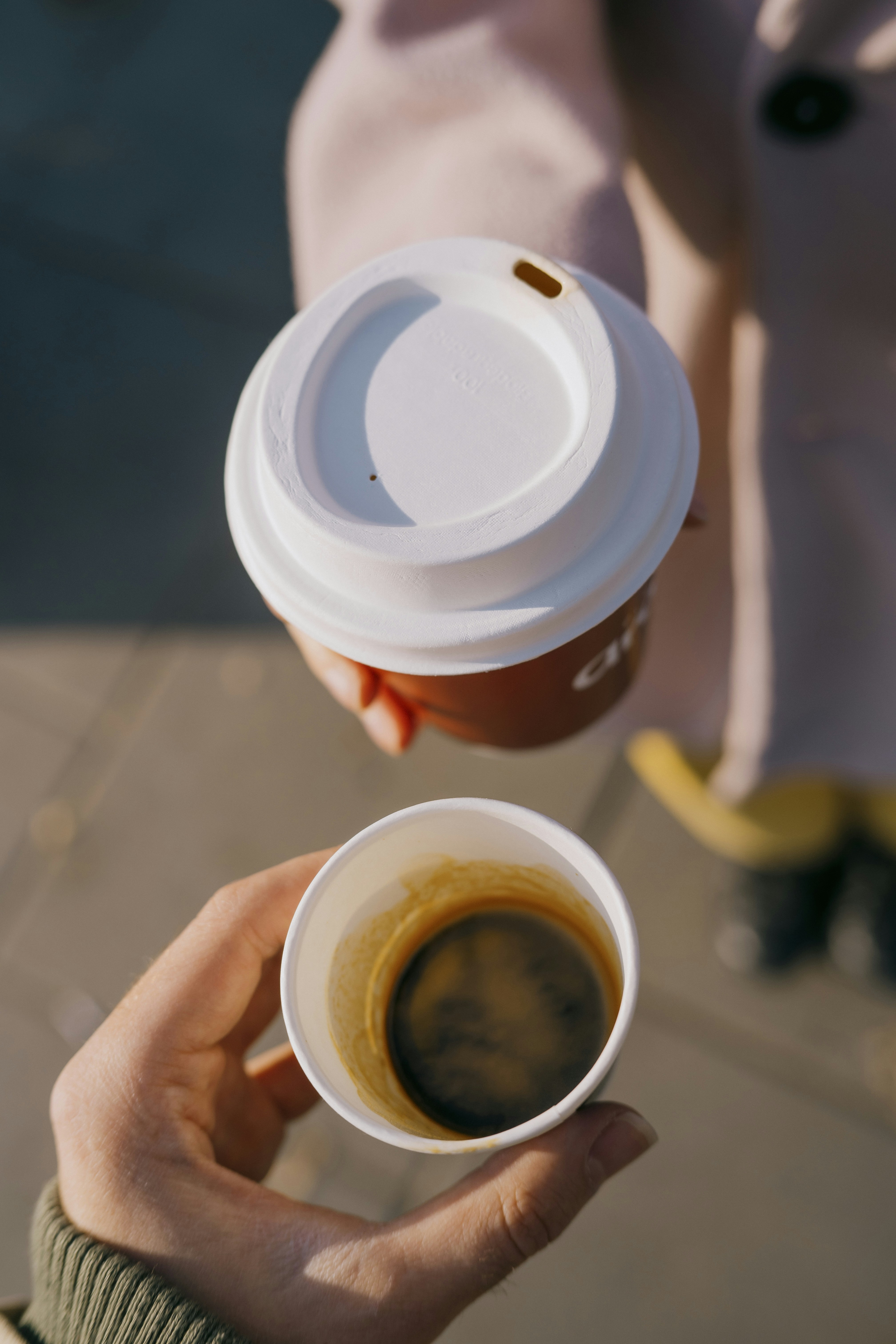 Someone is handing over a cup of coffee. photo – Free Coffee Image on ...