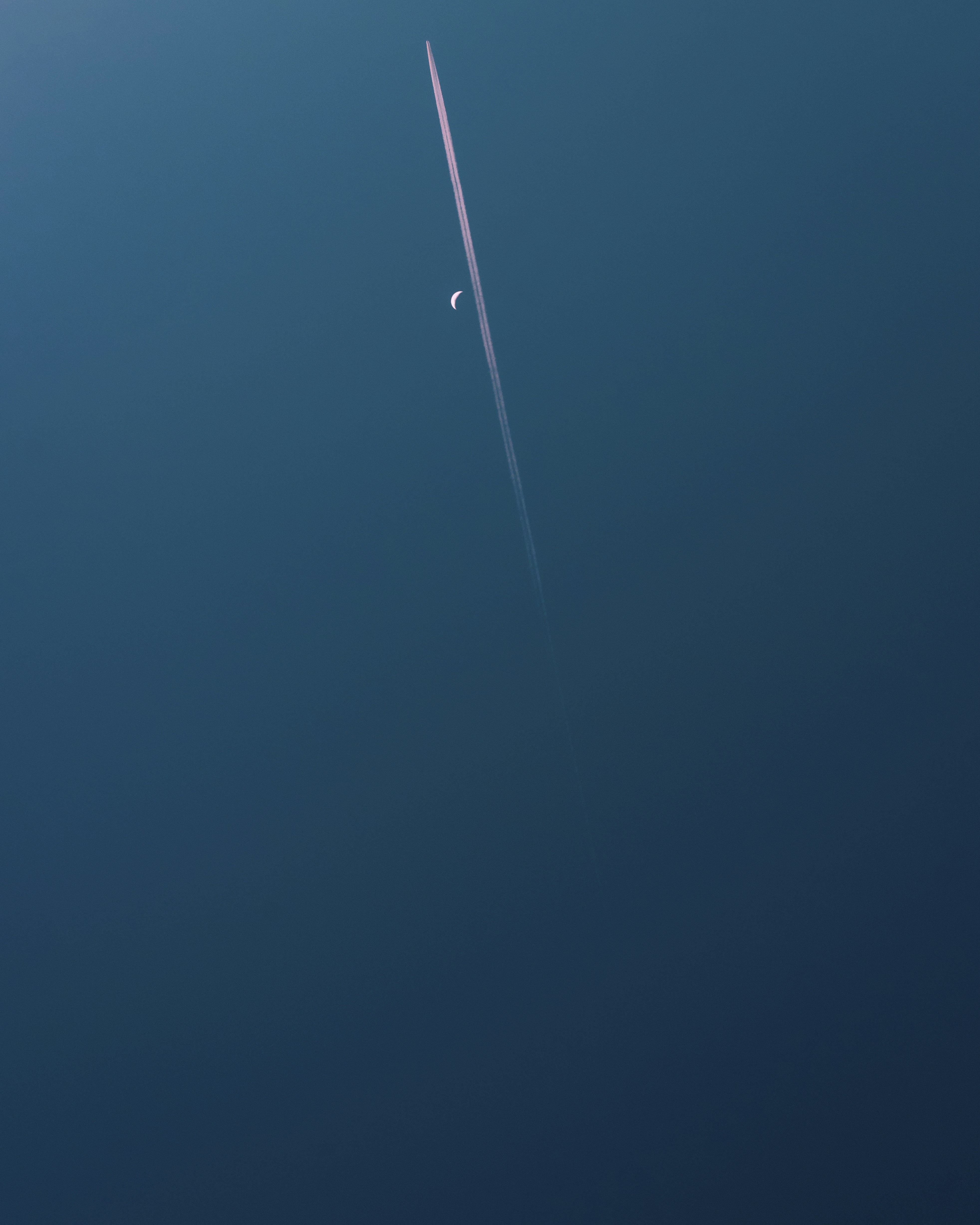 Airplane contrail crosses path with the moon. photo – Free Moon Image ...
