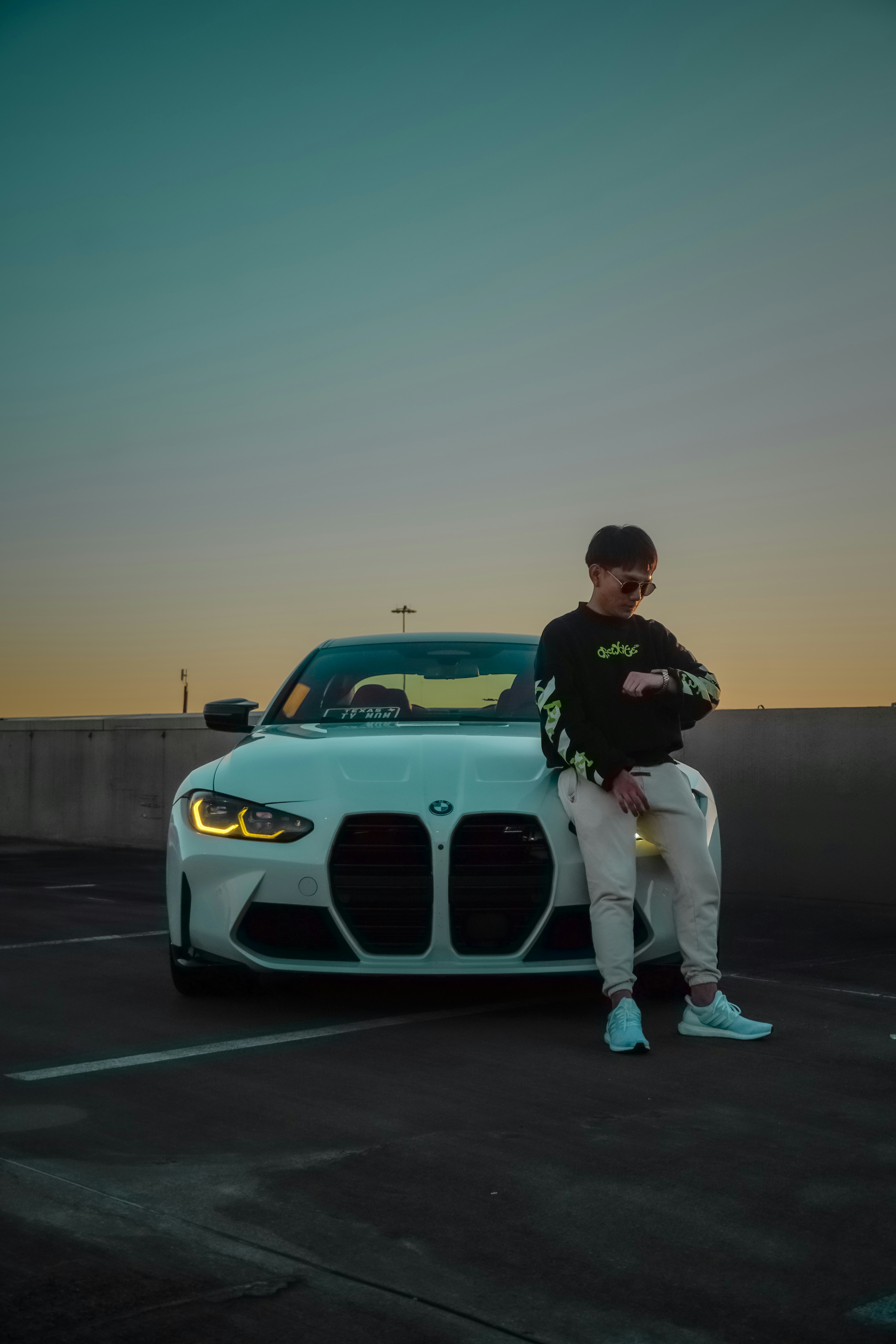 A man poses with his white bmw. photo – Free Car Image on Unsplash