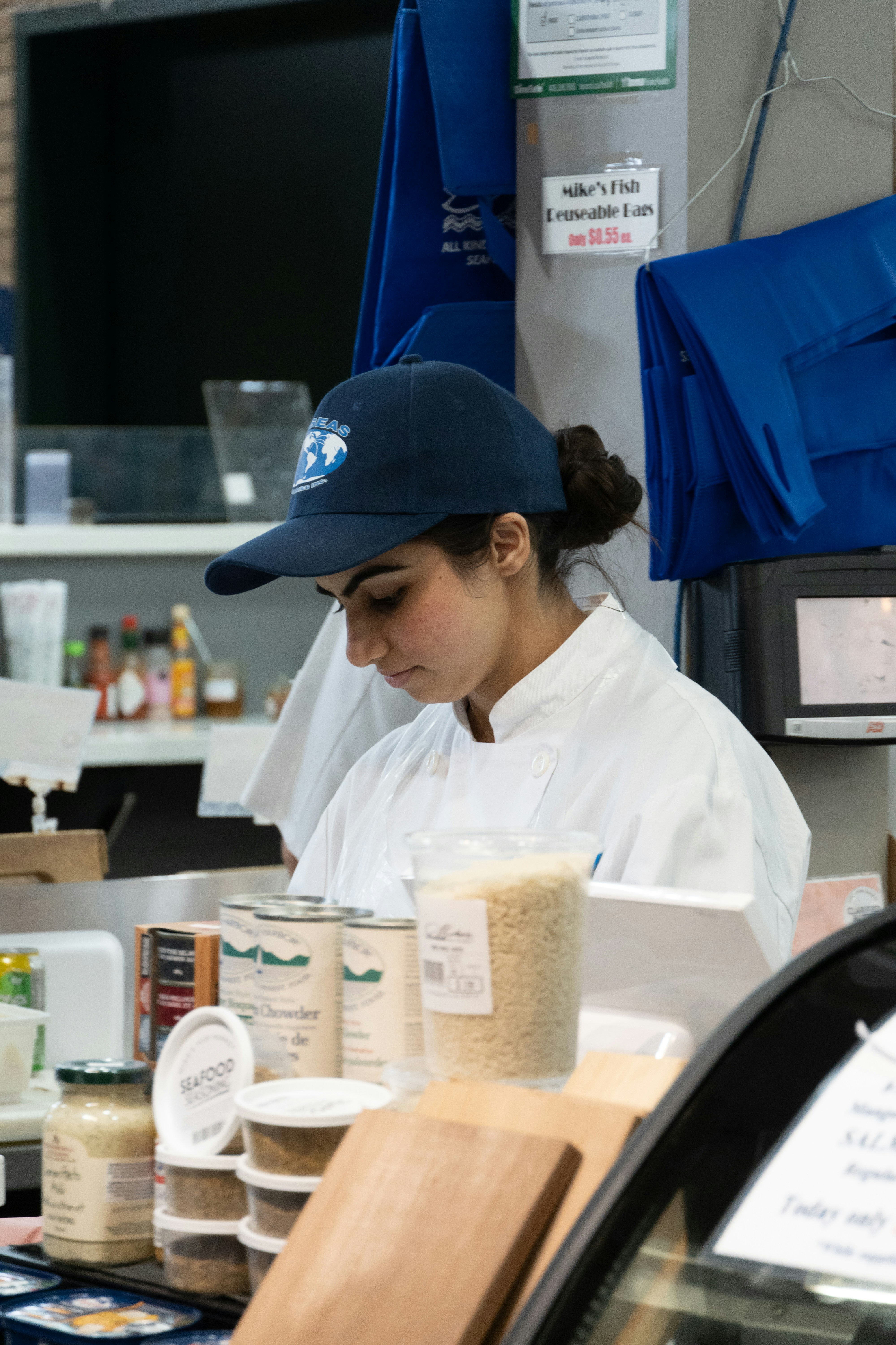 Blue Cap, White Coat: Focused Prep at the Market Counter