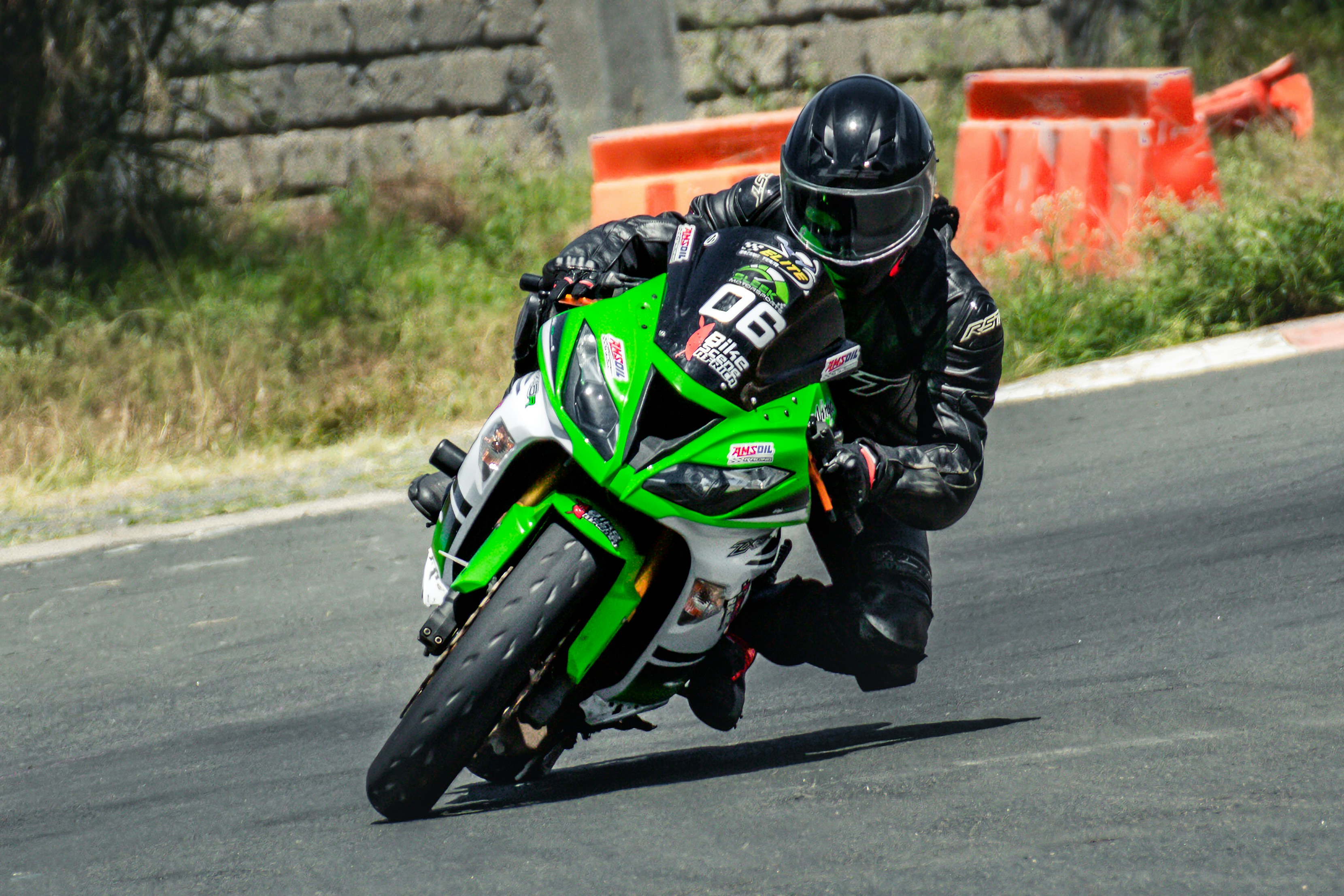 Motorcycle racer leaning into a sharp turn. photo – Free Racing ...