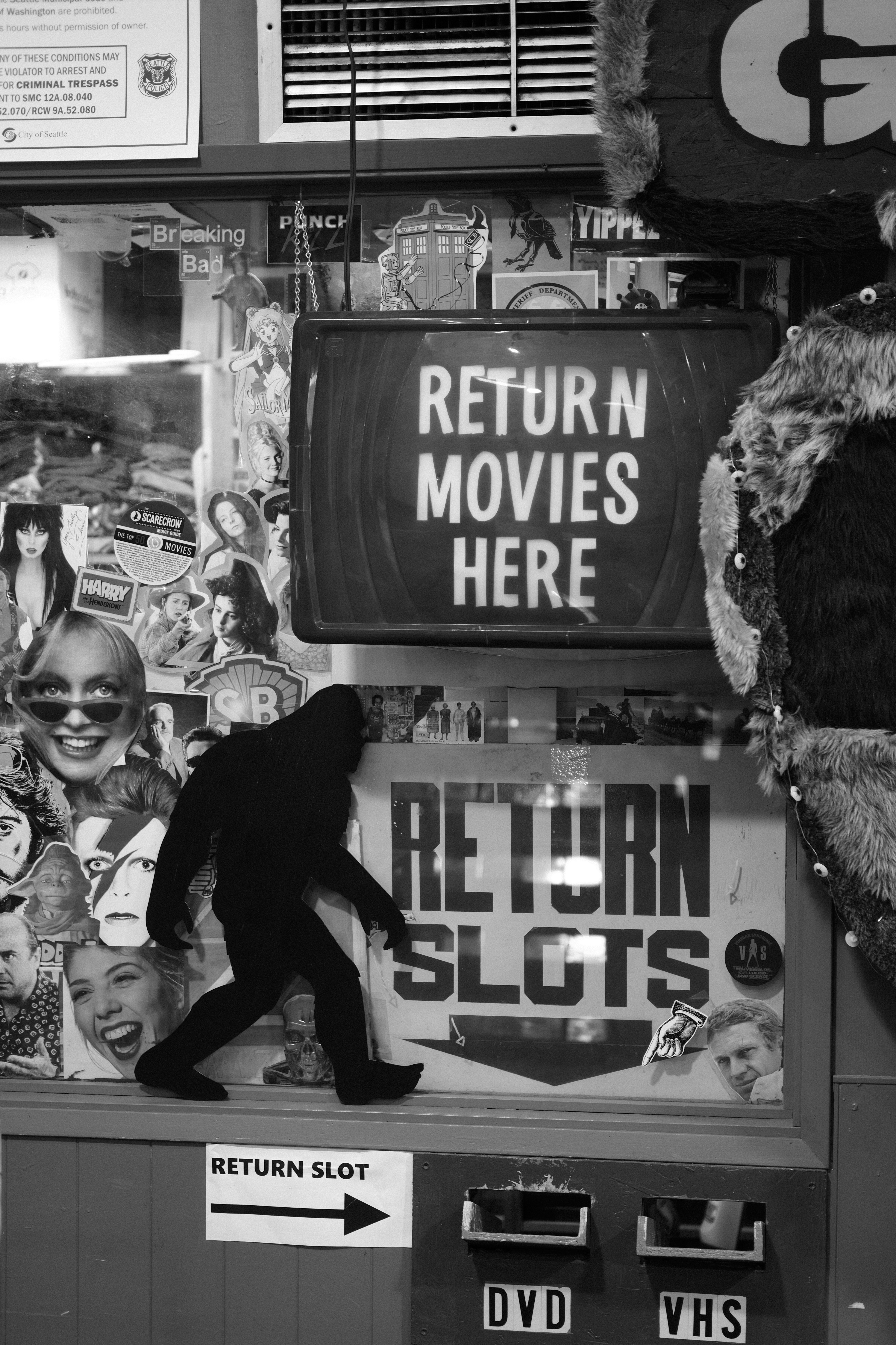 Video rental return sign with bigfoot silhouette. photo – Free Woman ...