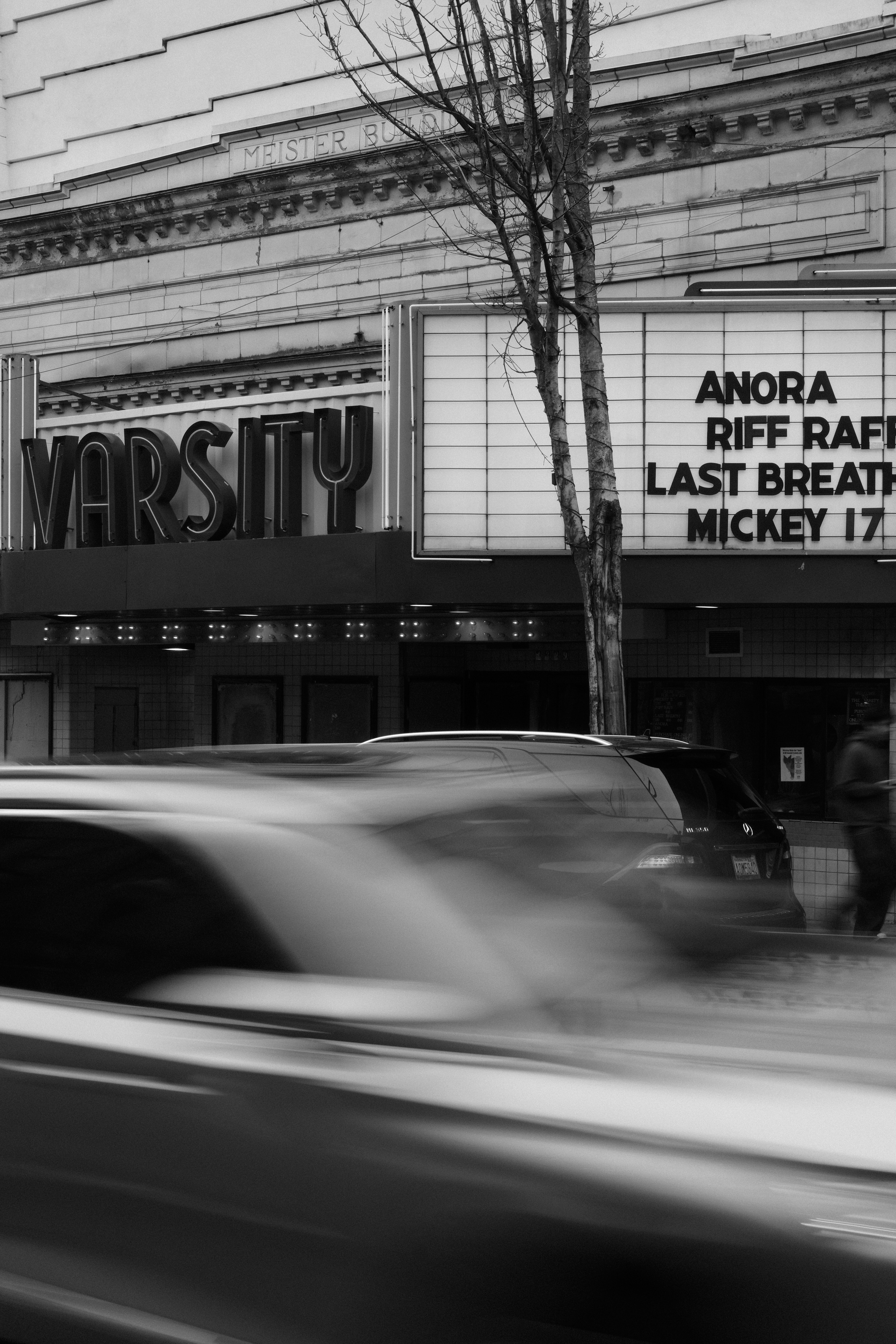 Varsity theater sign shows movie titles in a city. photo – Free Car ...