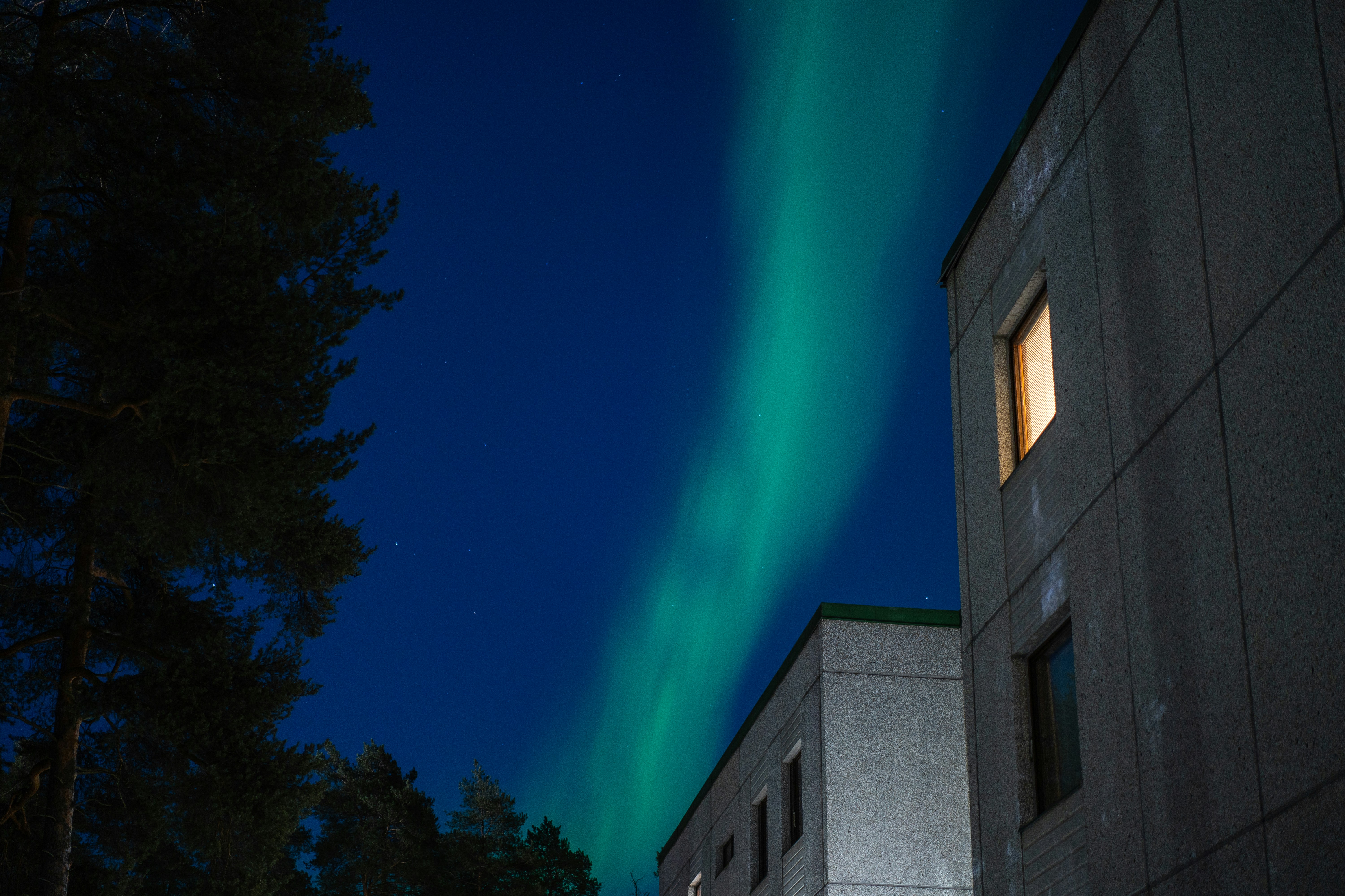 Urban Glow Under Northern Lights
