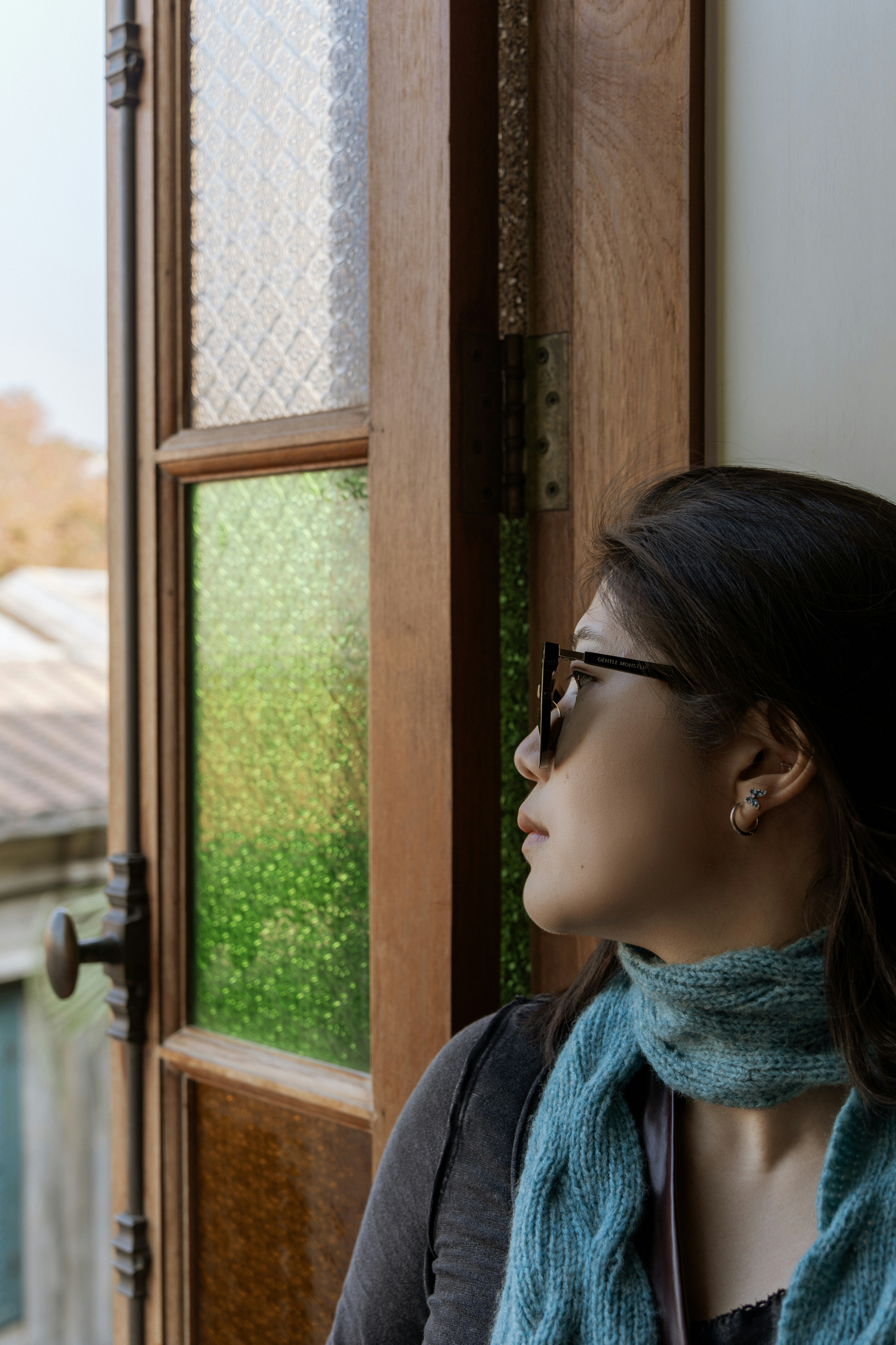Green Glass Gaze: Profile by an Open Doorway
