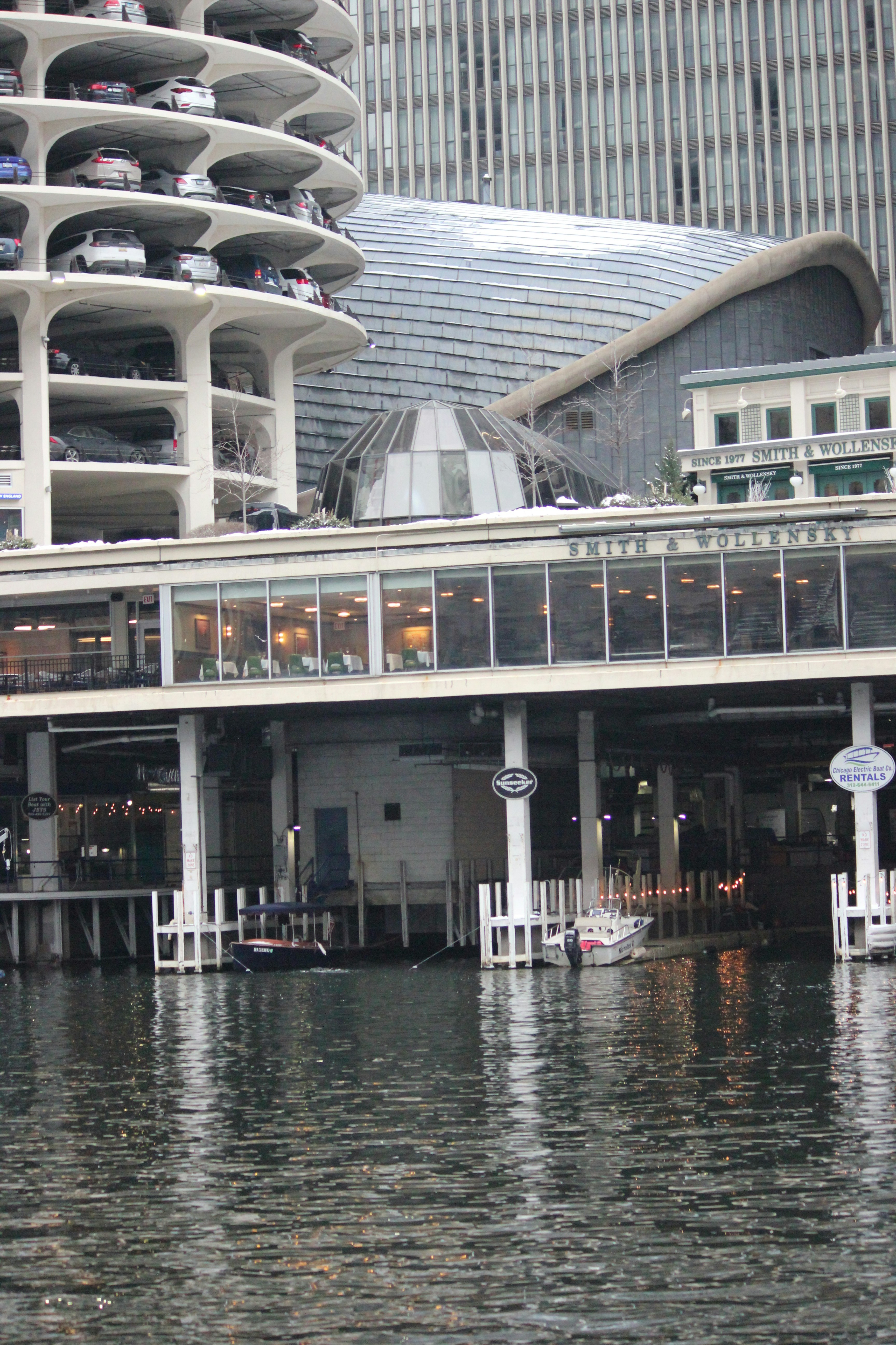Domed Glass Atrium Anchoring a Waterfront Restaurant Complex