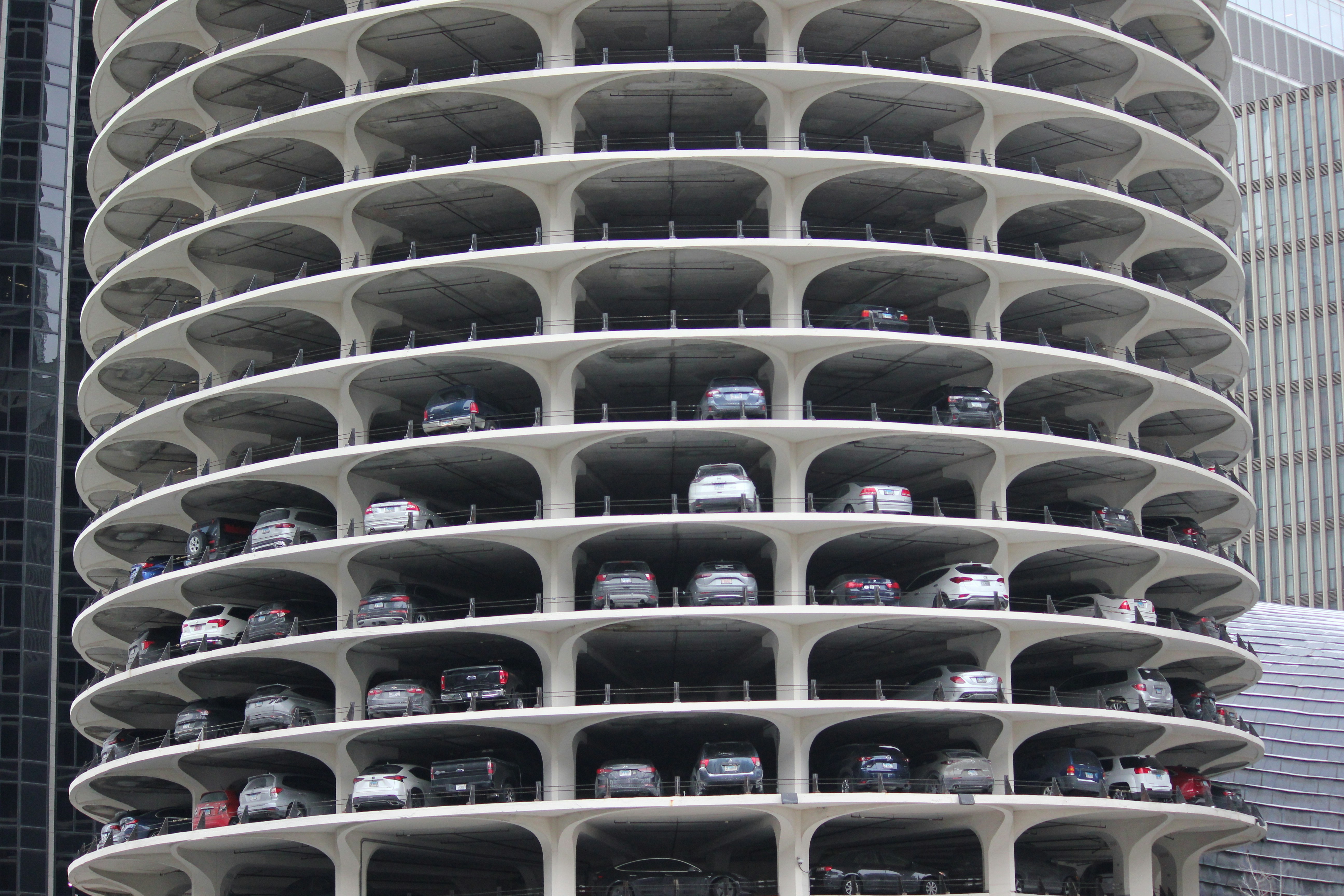 Circular parking garage with many parked cars. photo – Free Car Image ...