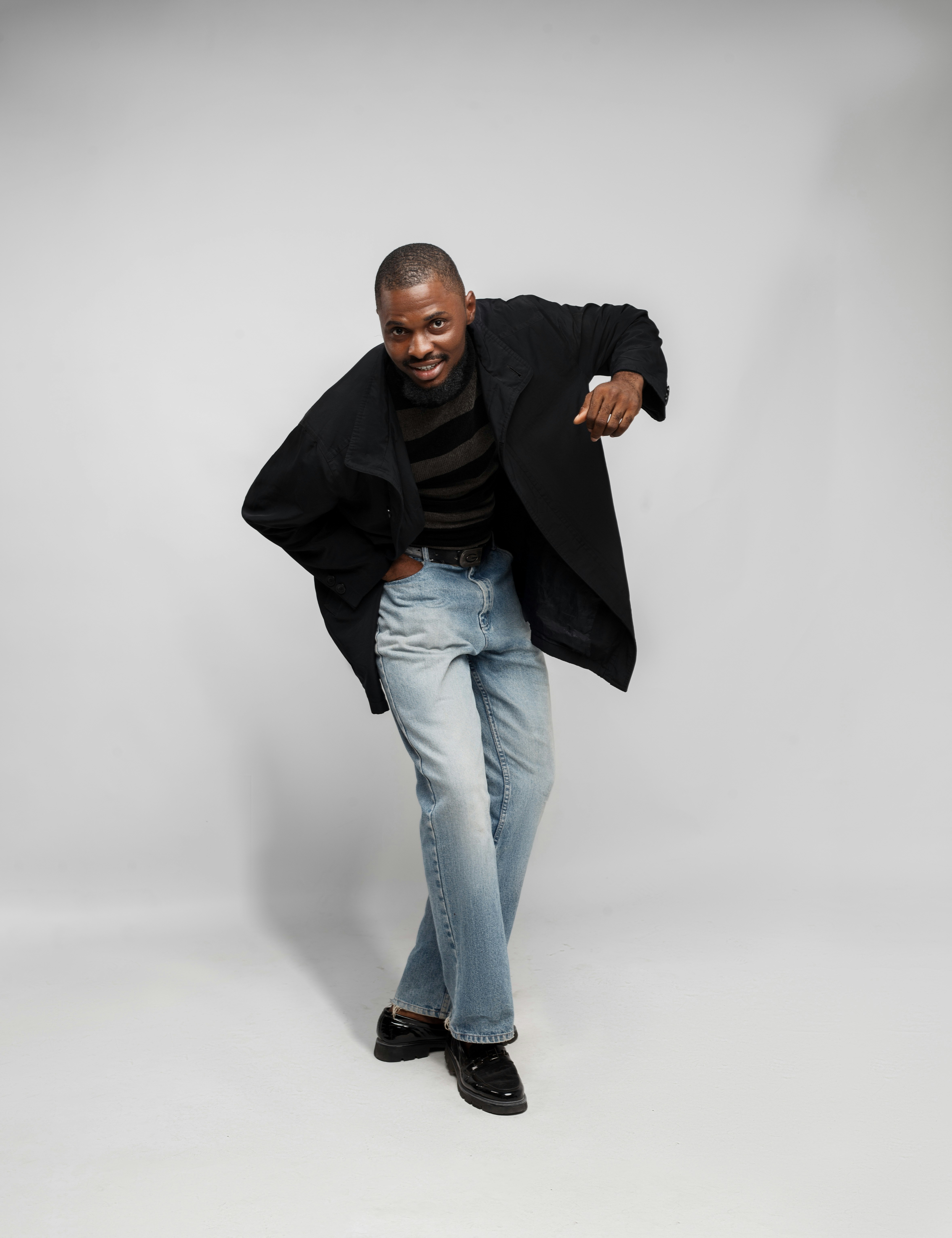 Mid-Pivot Groove: A Stepping Pose in a Monochrome Studio