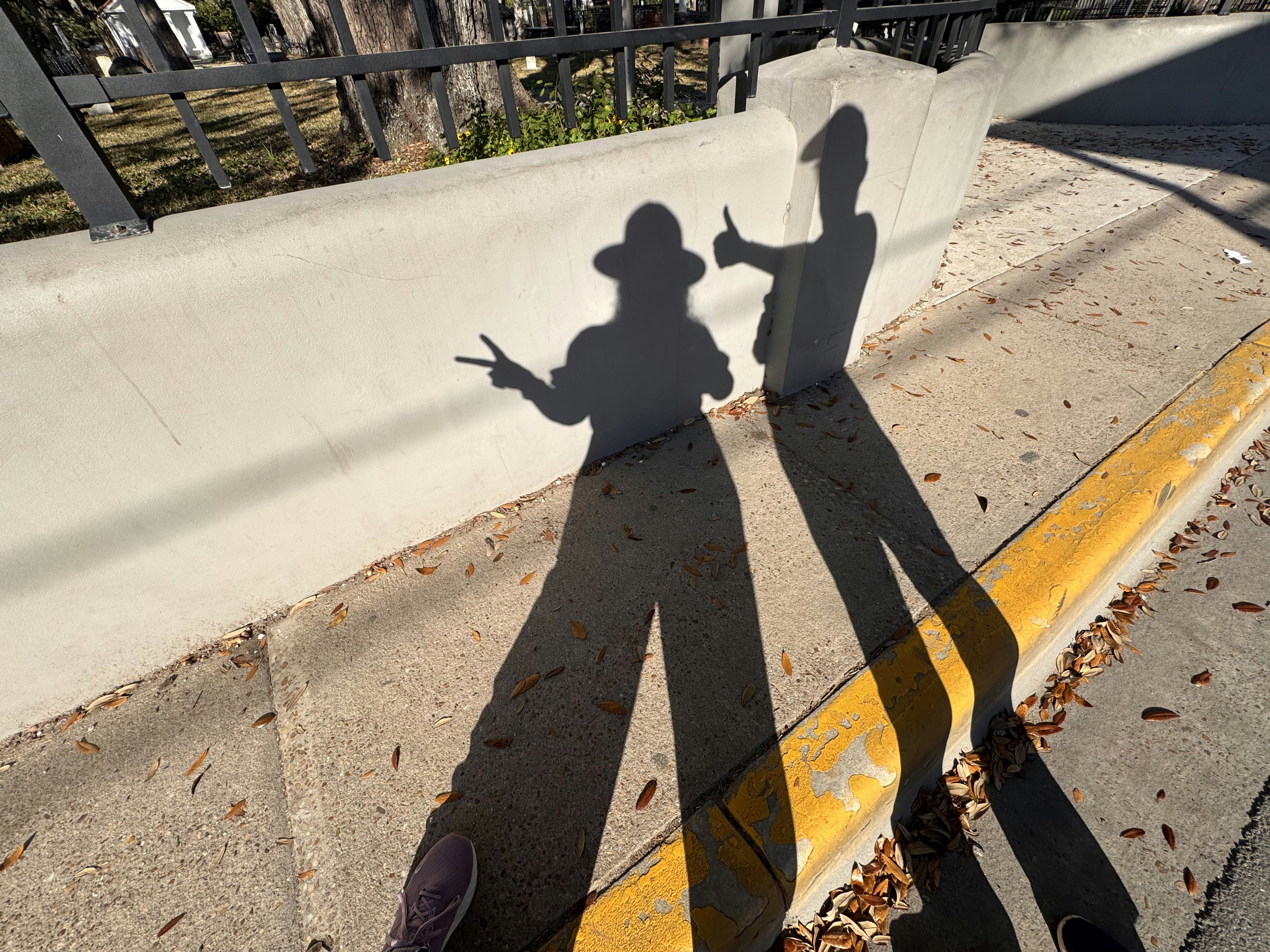 Shadows of two people posing happily outside. photo – Free Woman Image ...