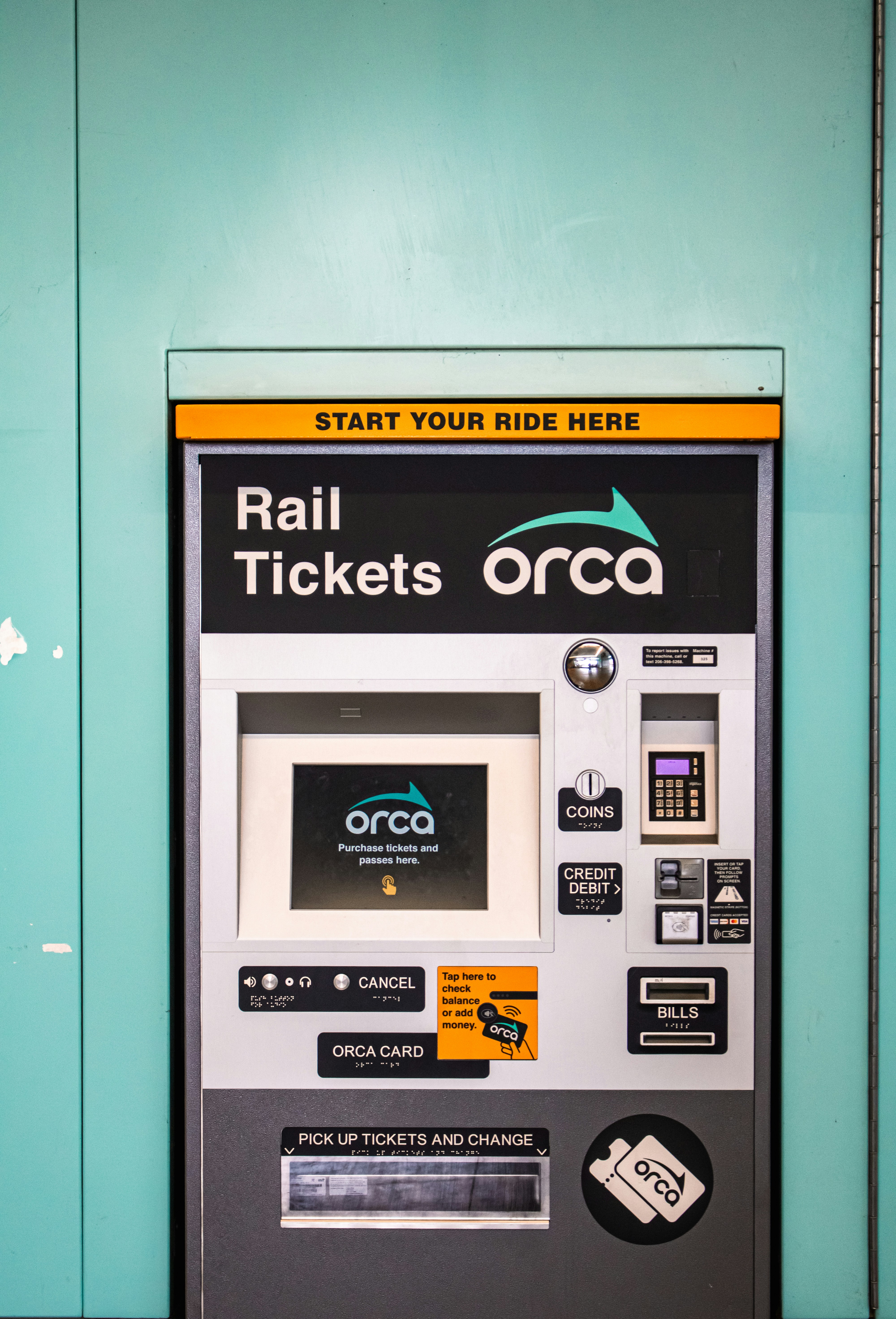 A rail tickets machine with orca branding. photo – Free Paper Image on ...