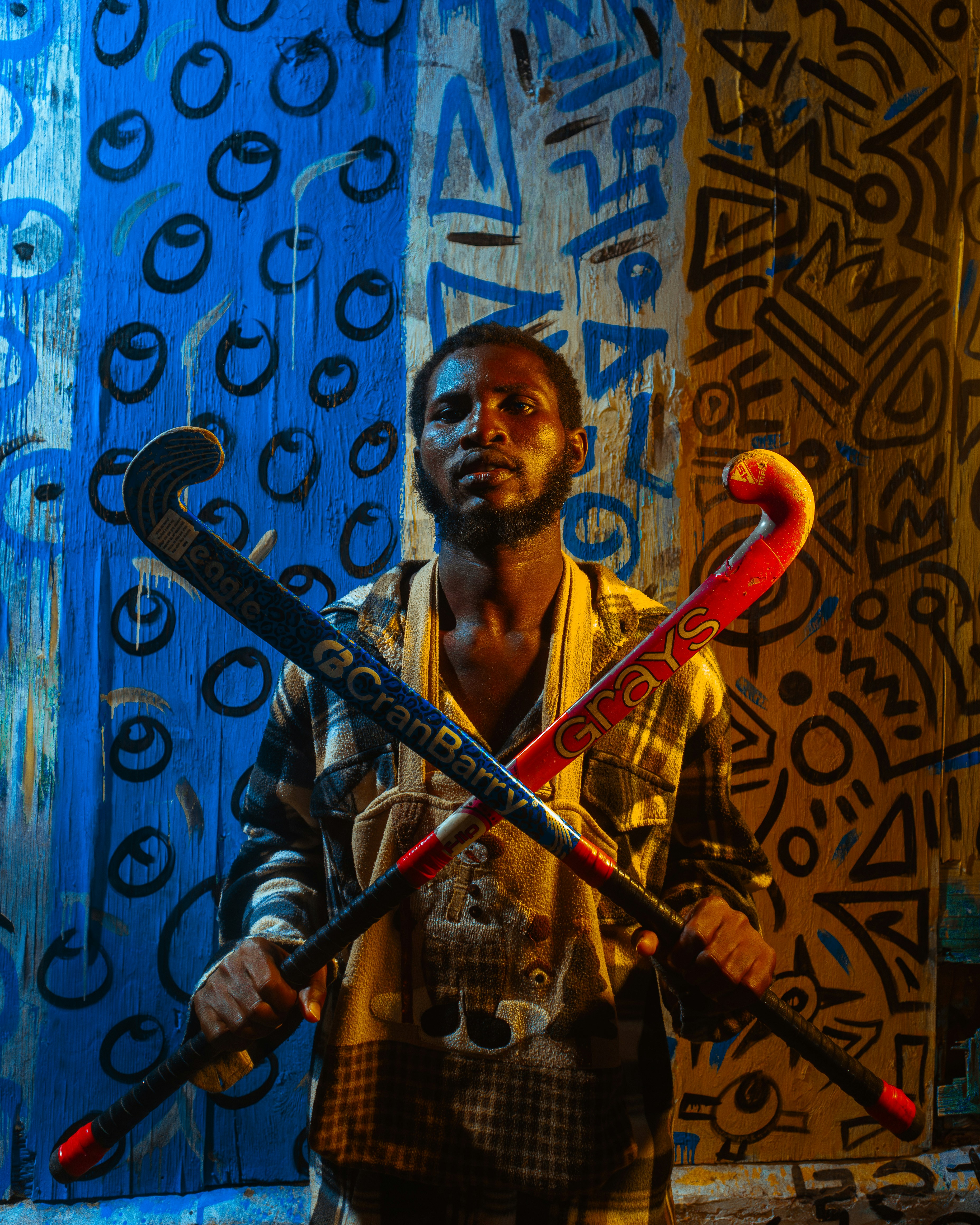 Crossed Bats, Neon Backdrop: A Portrait in Graffiti Light