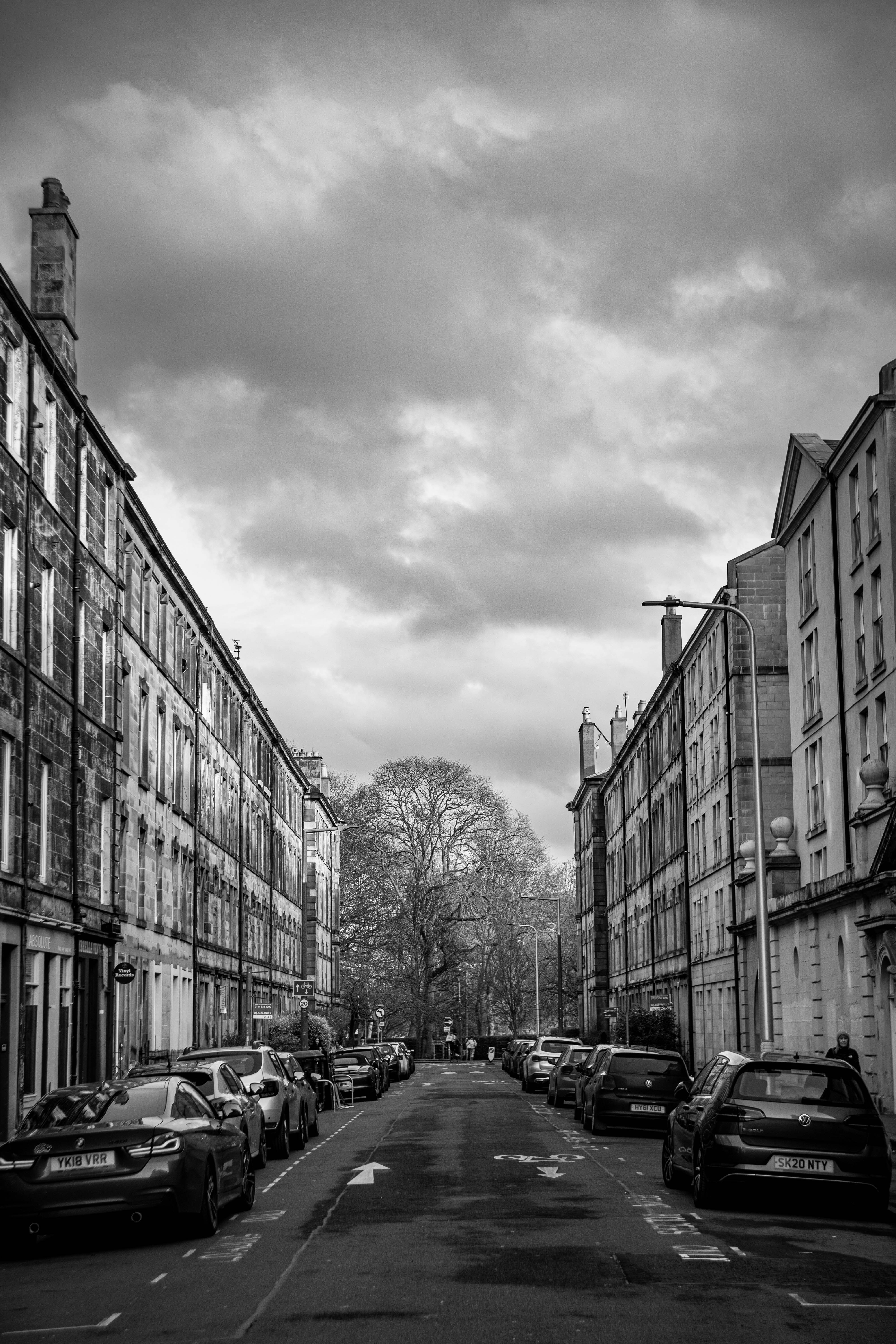 Urban Alleyway in Monochrome: A Quiet Street Between Rows of Historic Townhouses