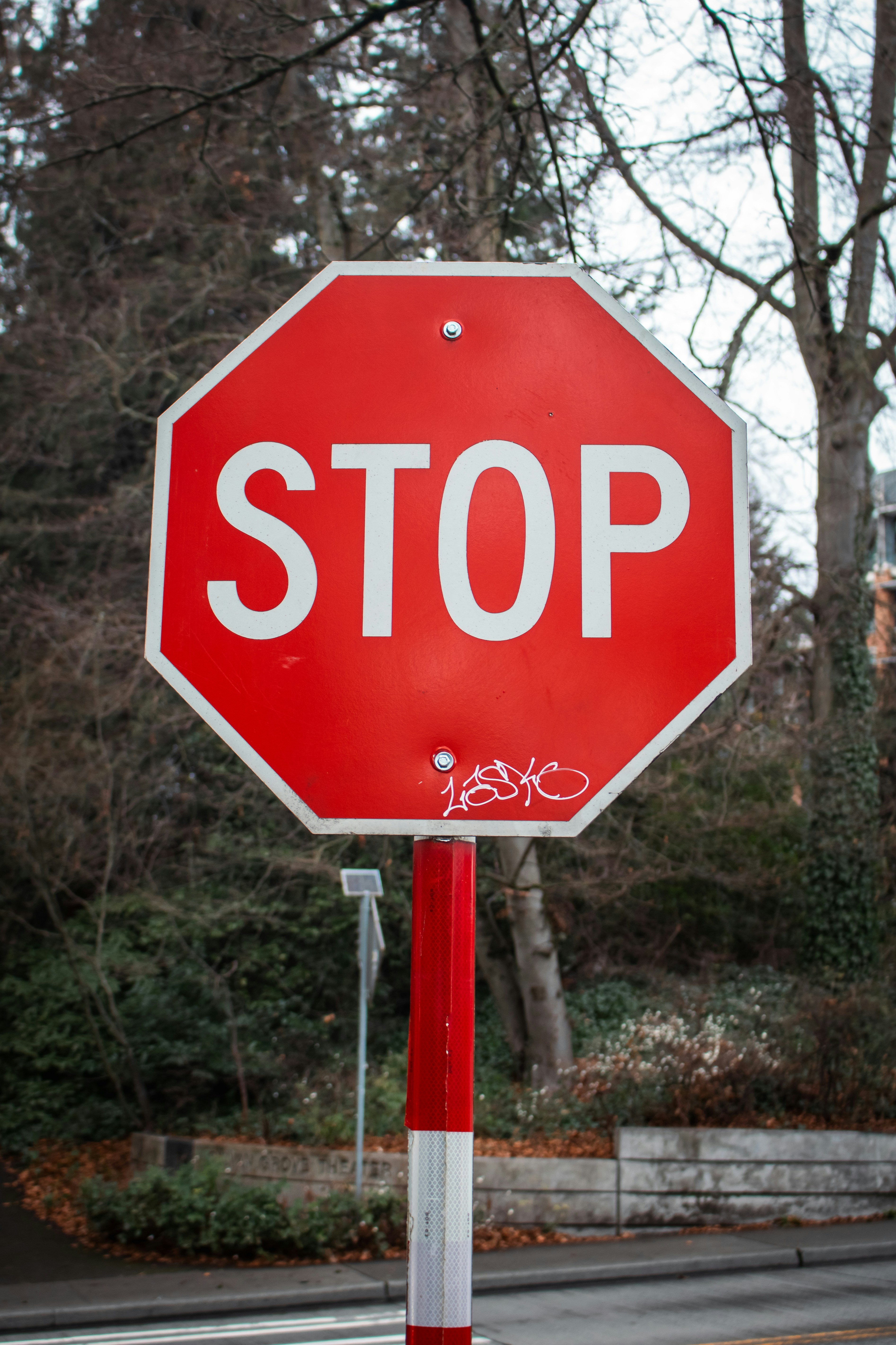 A red stop sign stands against the background. photo – Free City Image ...