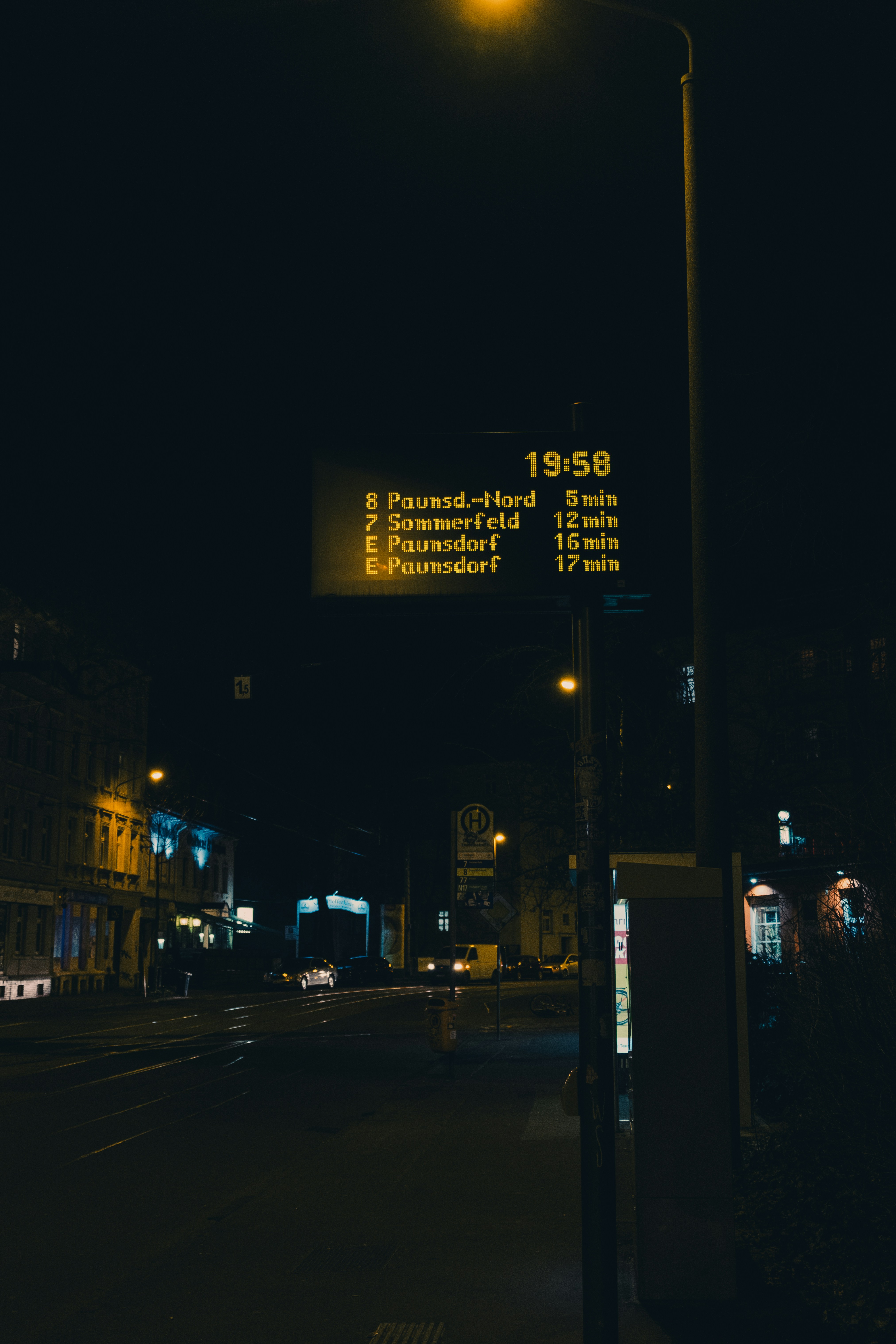 Nighttime bus stop with illuminated schedule. photo – Free Dark Image ...