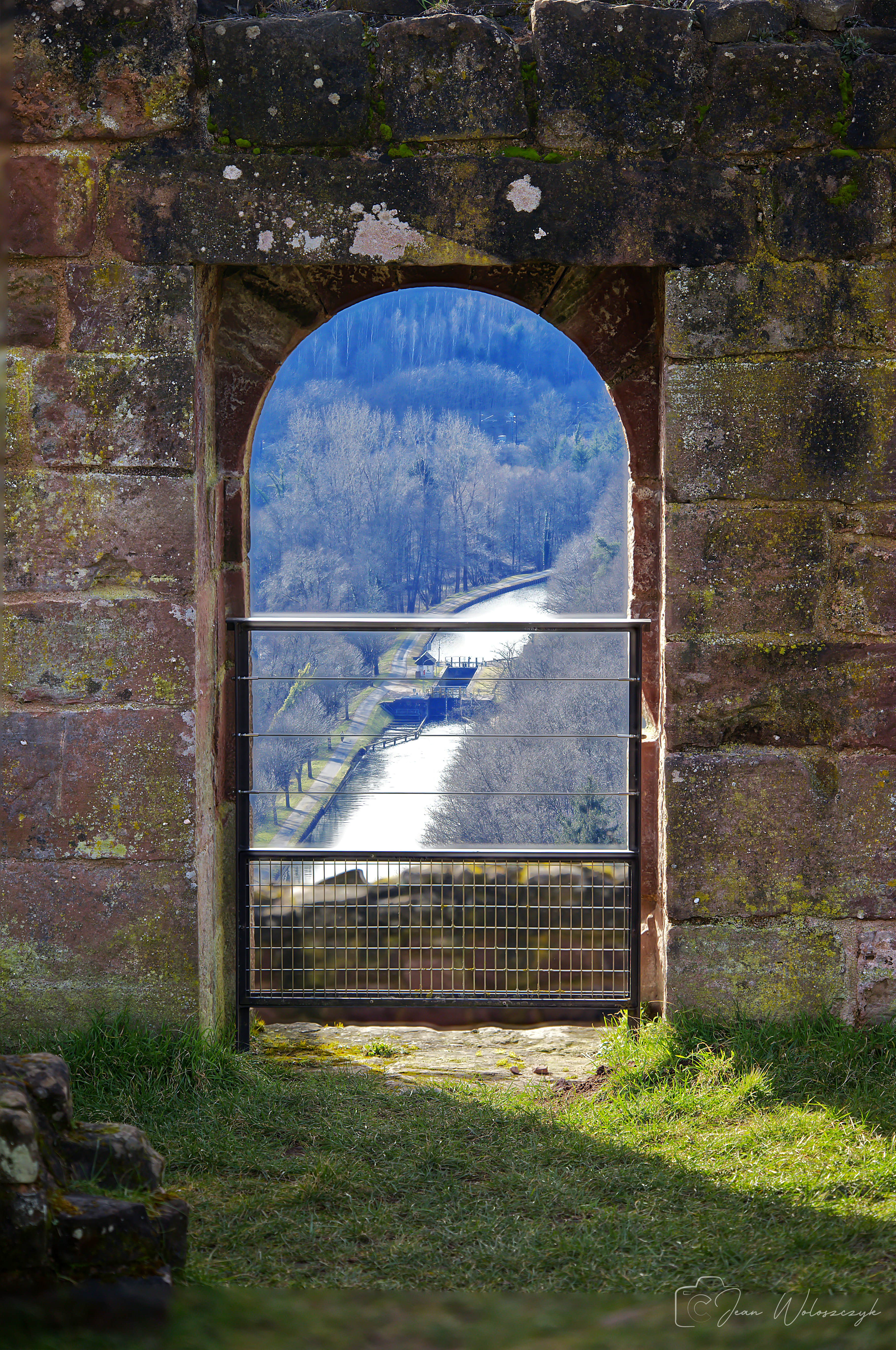 Archway Vista: A Quiet Corridor to the Distant Road
