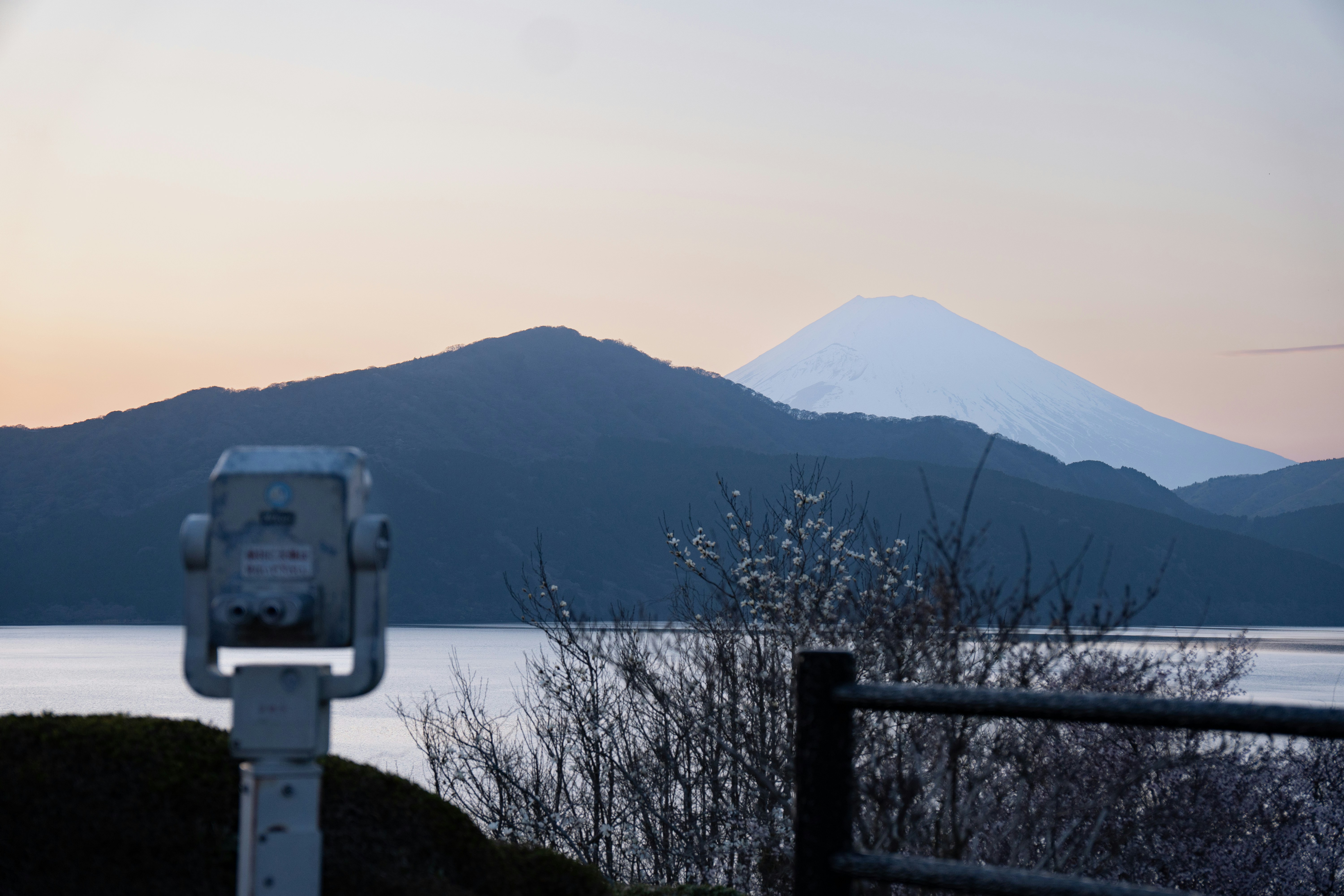 Dawn Viewfinder: A Coastline Telescope Framing Mt. Fuji
