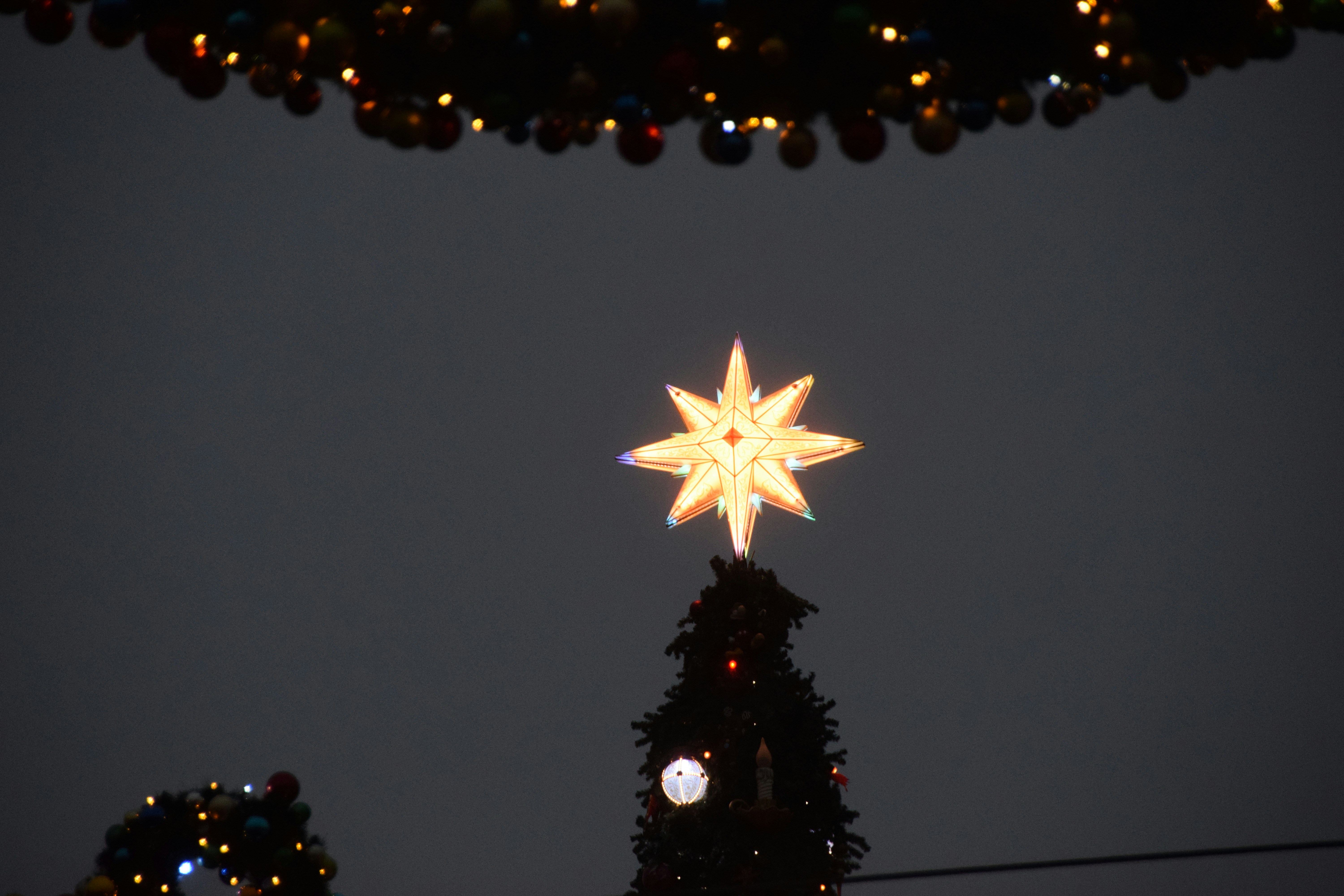 France and Spain Trip 2024-2025 | A christmas tree star shines brightly in the night.