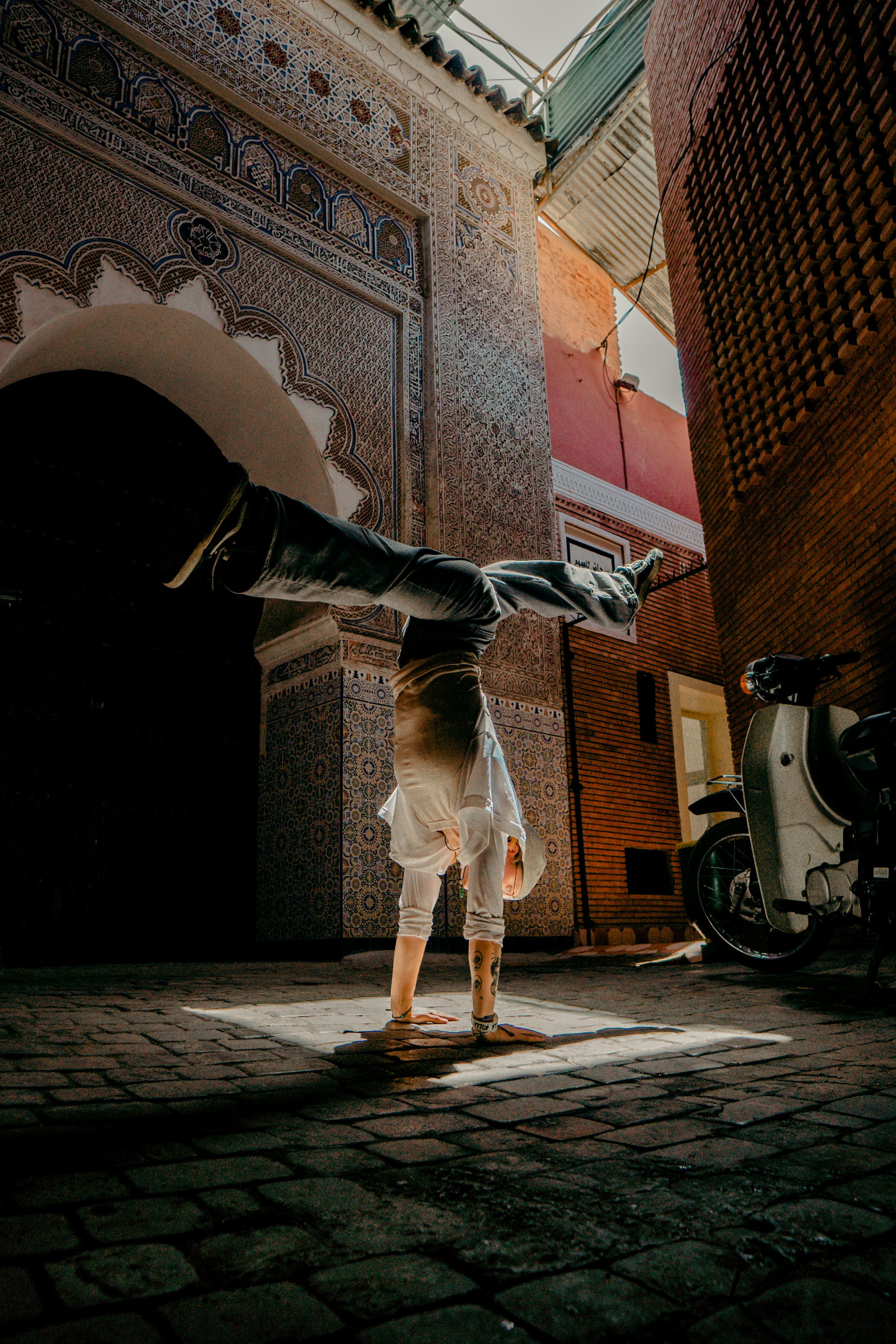 Midair Flip Against an Ornate Archway