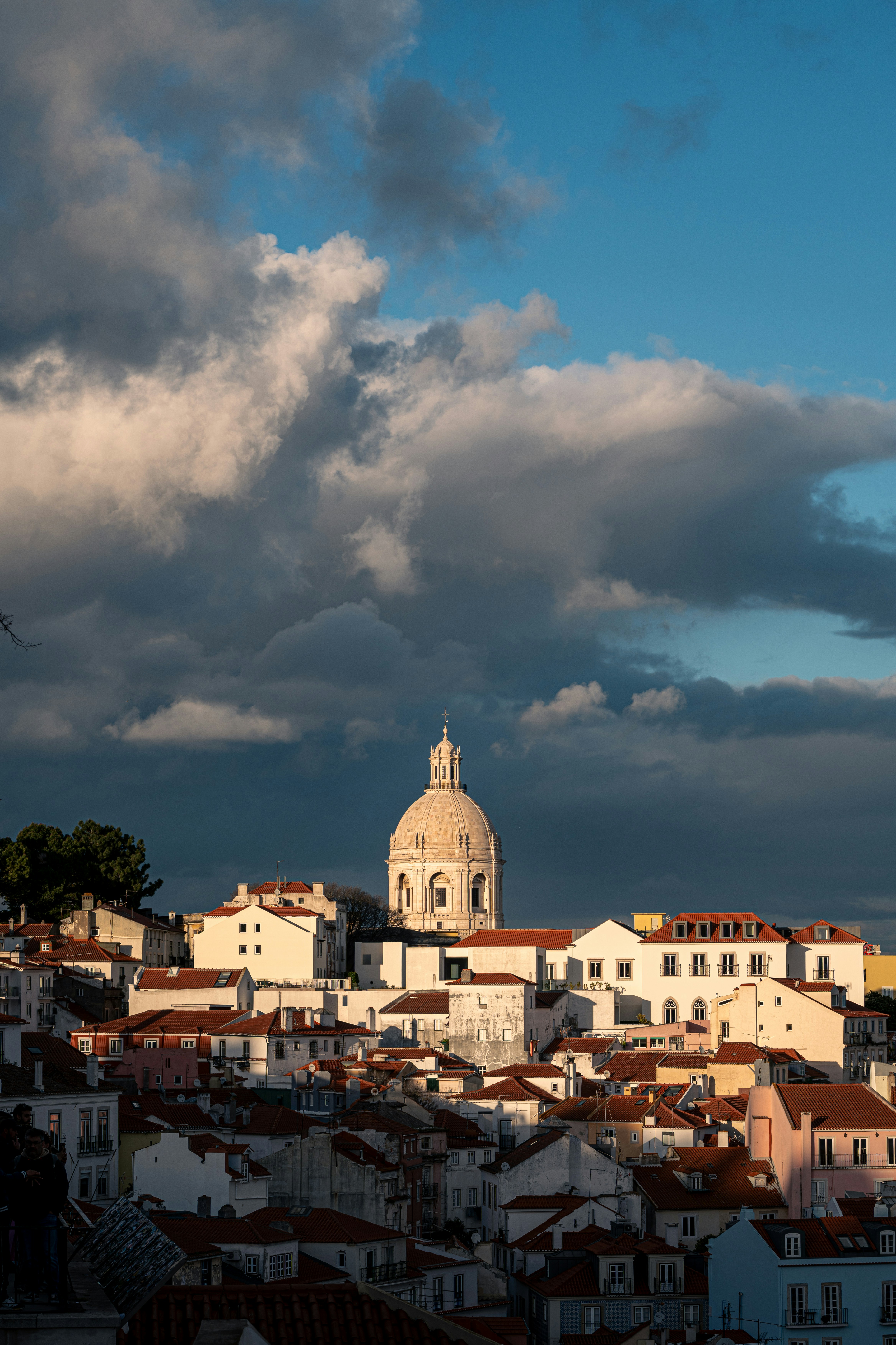 Dome Crowned Over a Red-Tiled Hillside City at Golden Hour