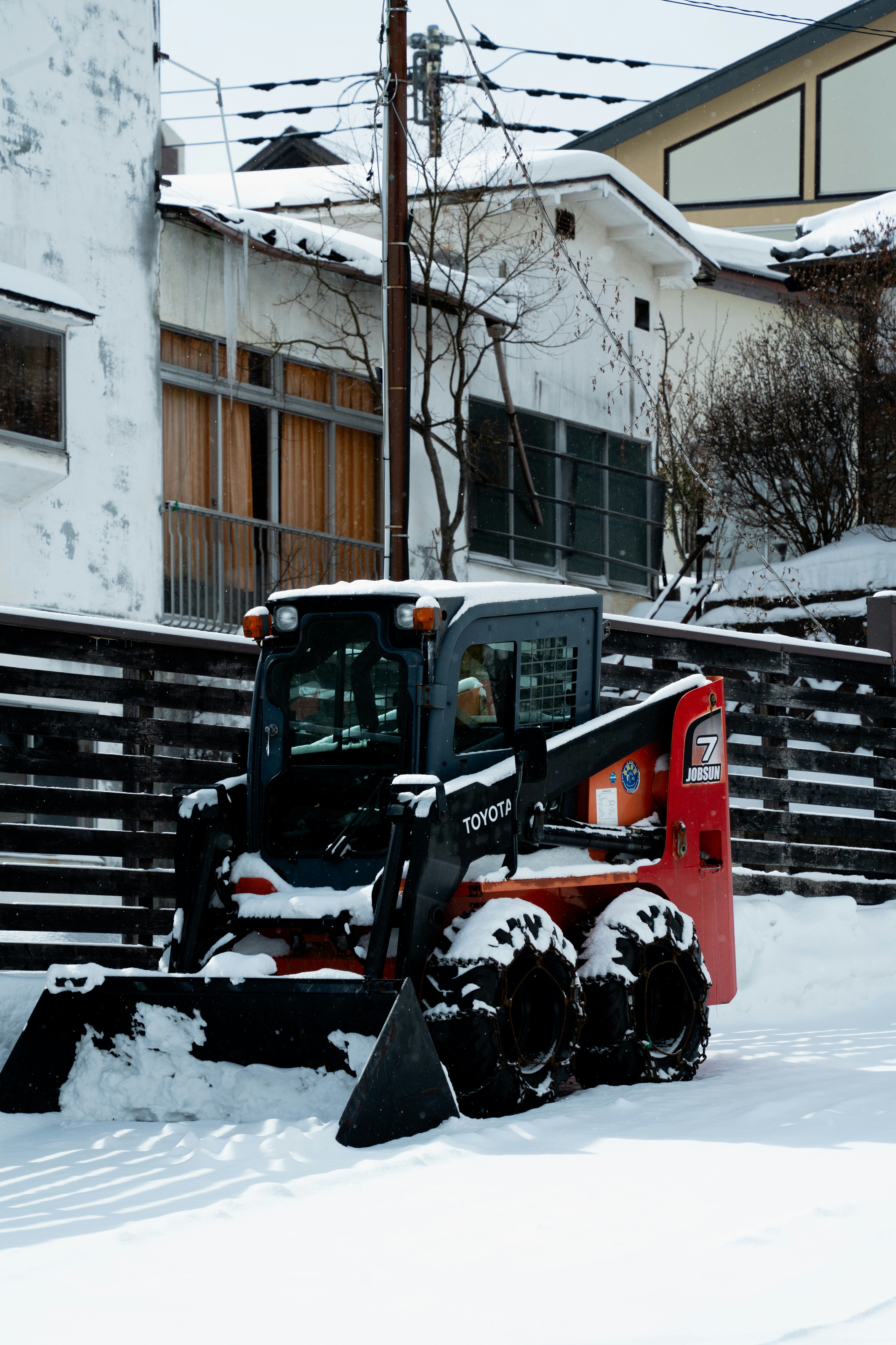 Snowbound Skid Steer: A Quiet Winter Scene with a Toyotapowered Loader